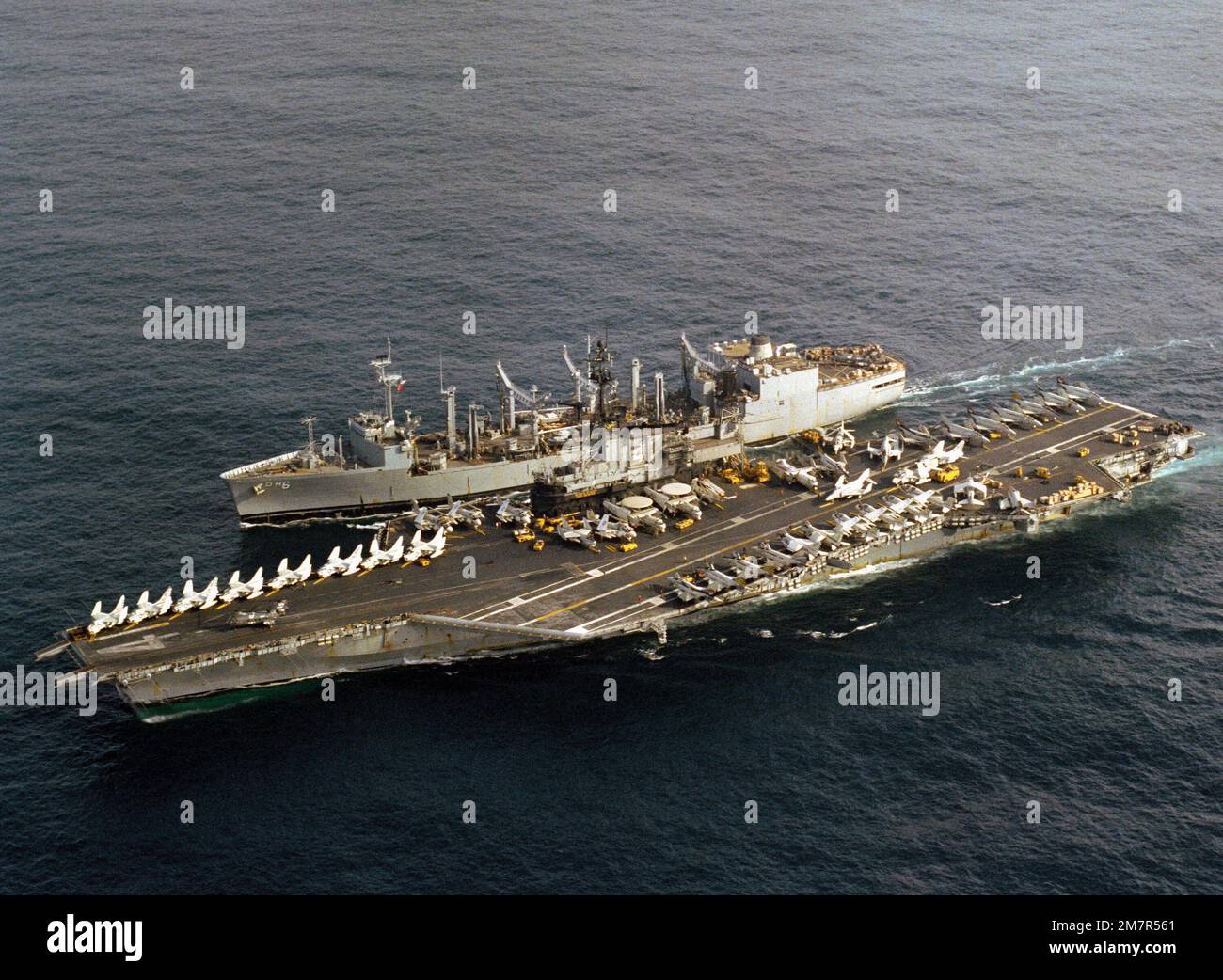An aerial port beam view of the aircraft carrier USS MIDWAY (CV 41) and ...