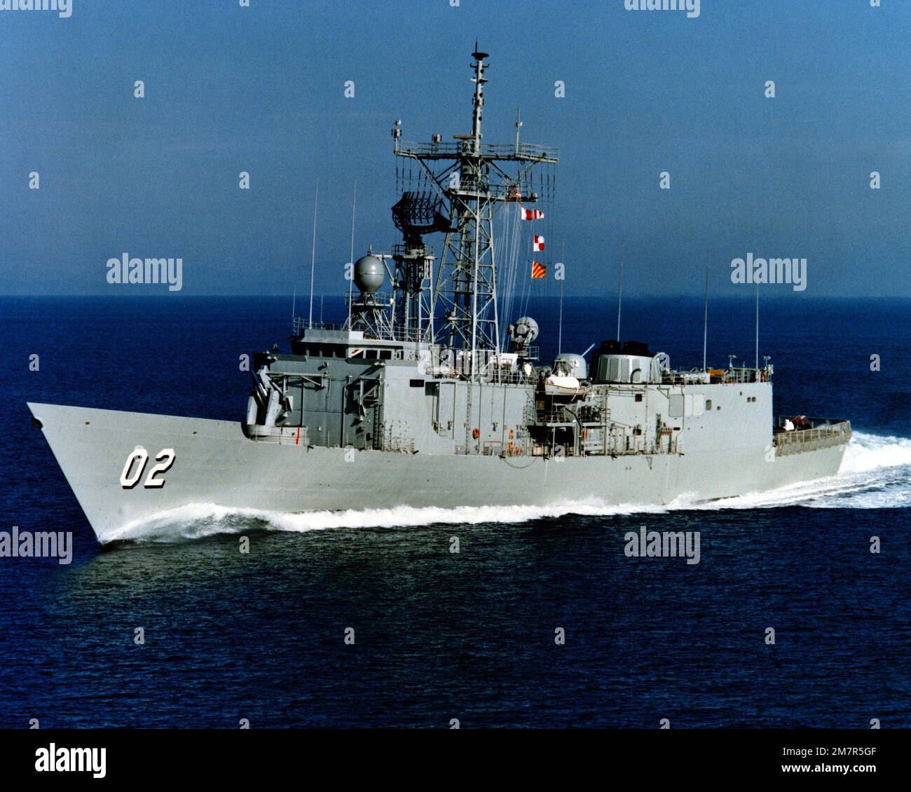 A port bow view of the Australian frigate CANBERRA (F-02) as Todd ...