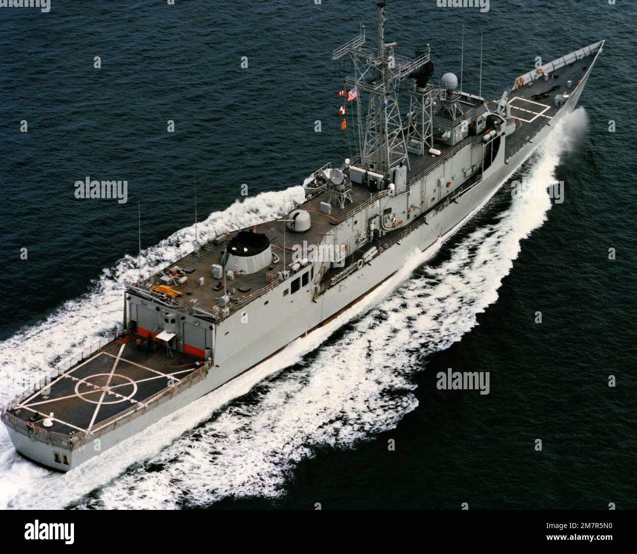 An aerial starboard quarter view of the Australian frigate CANBERRA (F ...