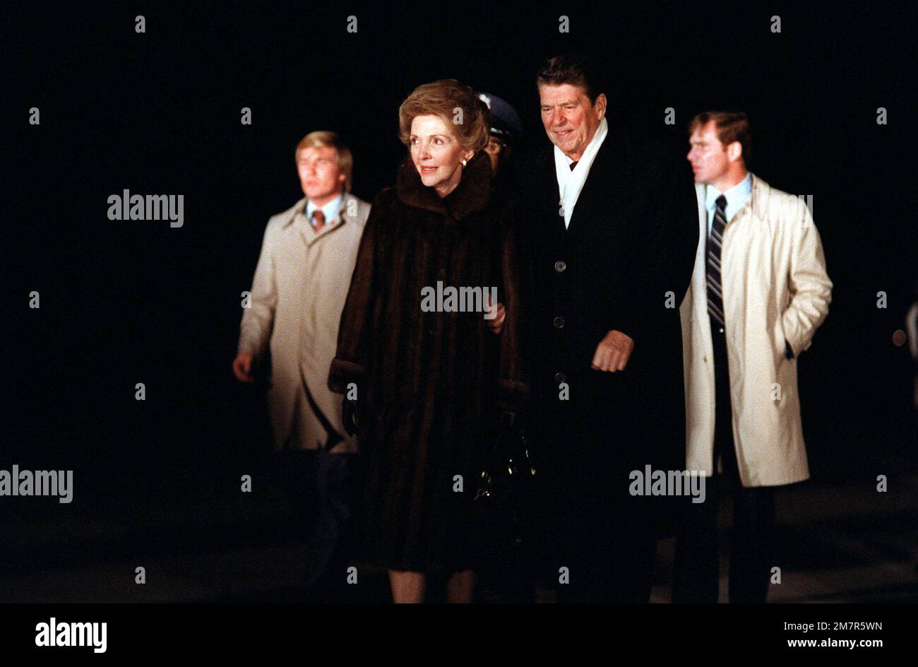 President-elect Ronald W. Reagan and his wife, Nancy, walk across the ...