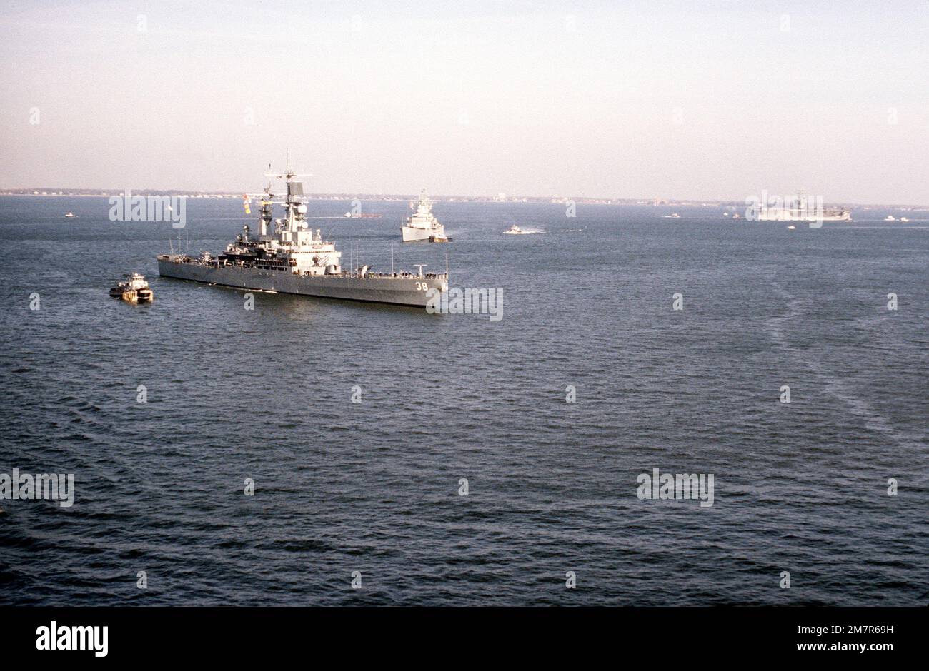 Aerial starboard bow view of the nuclear-powered aircraft carrier USS VIRGINIA (CGN-38) leading ...