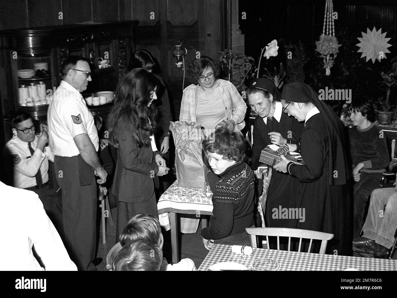 During a visit to the Eisenschmidt Orphanage, a master sergeant and a ...