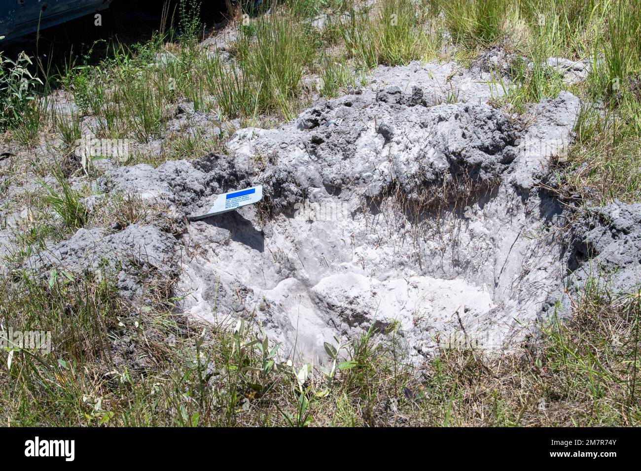 A hole and fin left from an inert GBU-58 Paveway II bomb off of an AT ...
