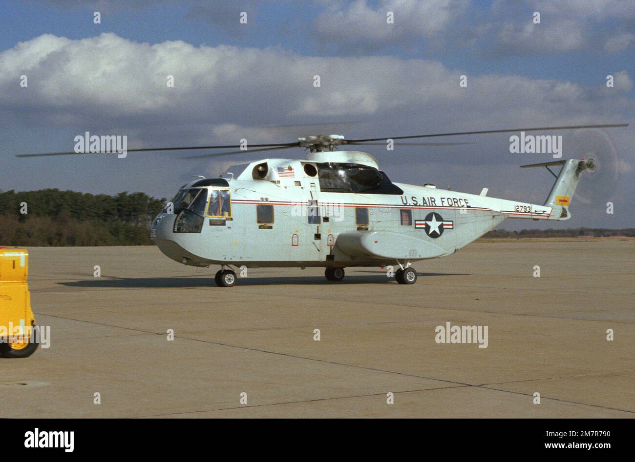 A left side view of an Air Force CH-3 Jolly Sea King helicopter parked ...