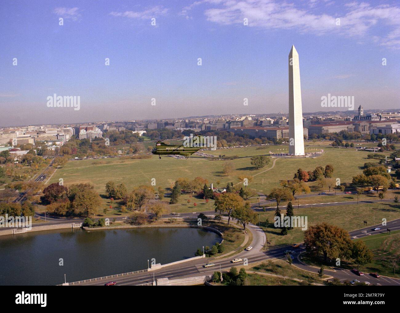 An air-to-air left side view of a Marine CH-46 Sea Knight helicopter ...