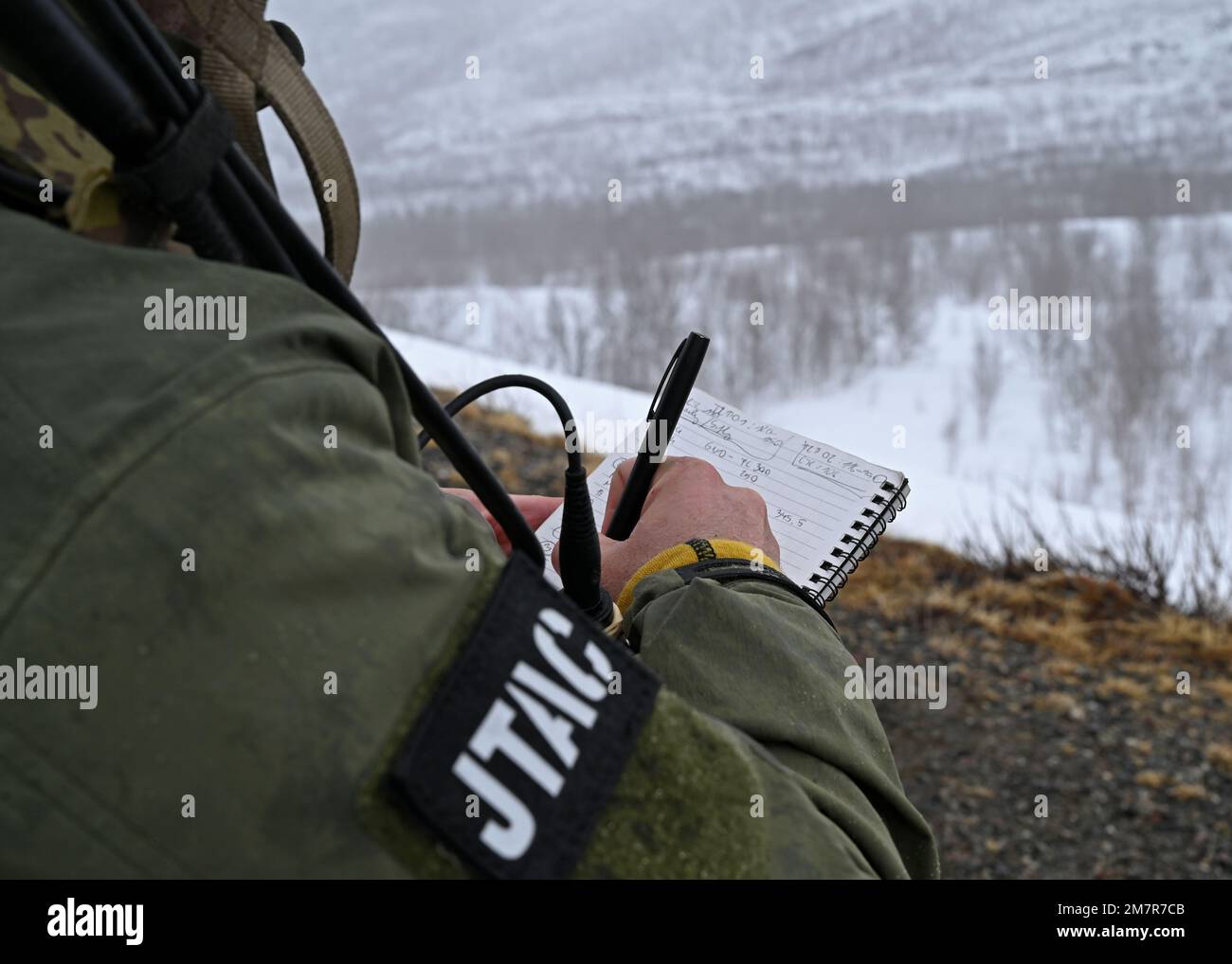 A Hungarian joint terminal attack controller takes notes as he prepares ...