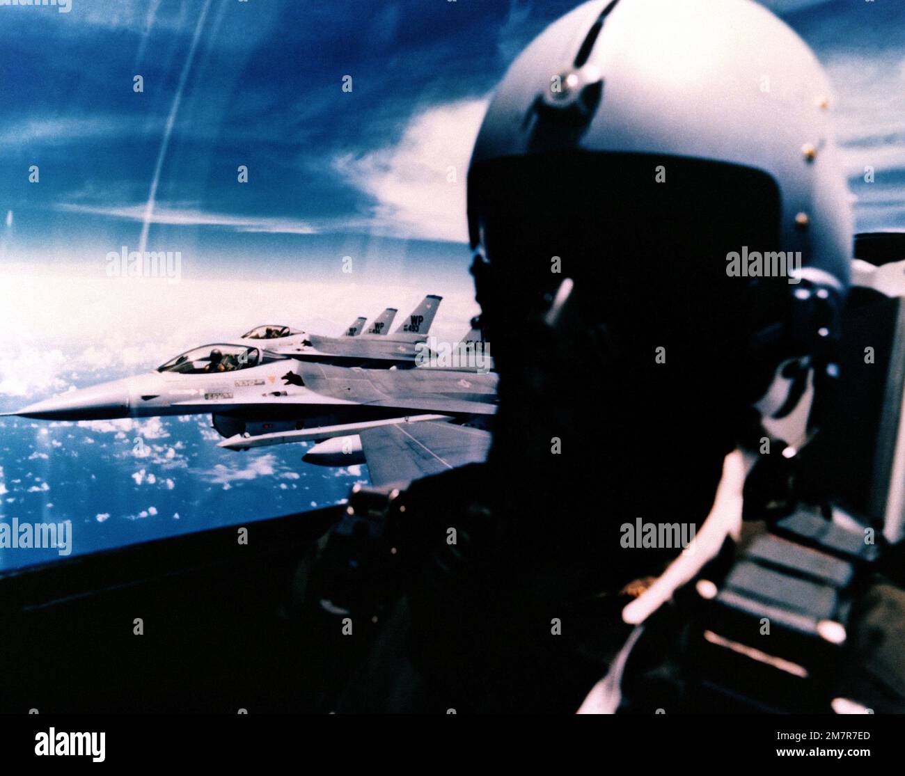 A view of an in-flight F-16A Fighting Falcon aircraft pilot, with other ...