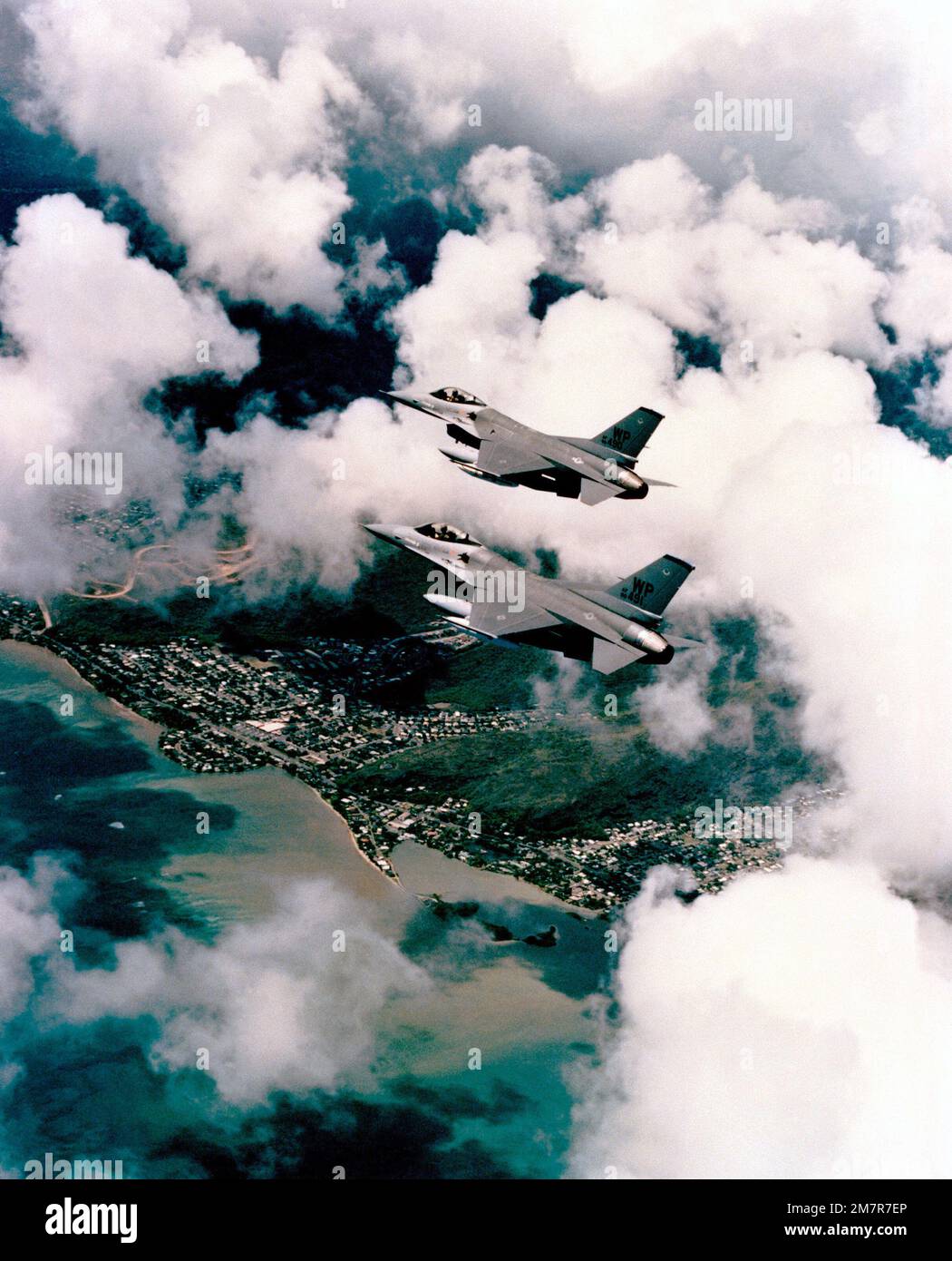 A left rear view of two F-16A Fighting Falcon aircraft during ...