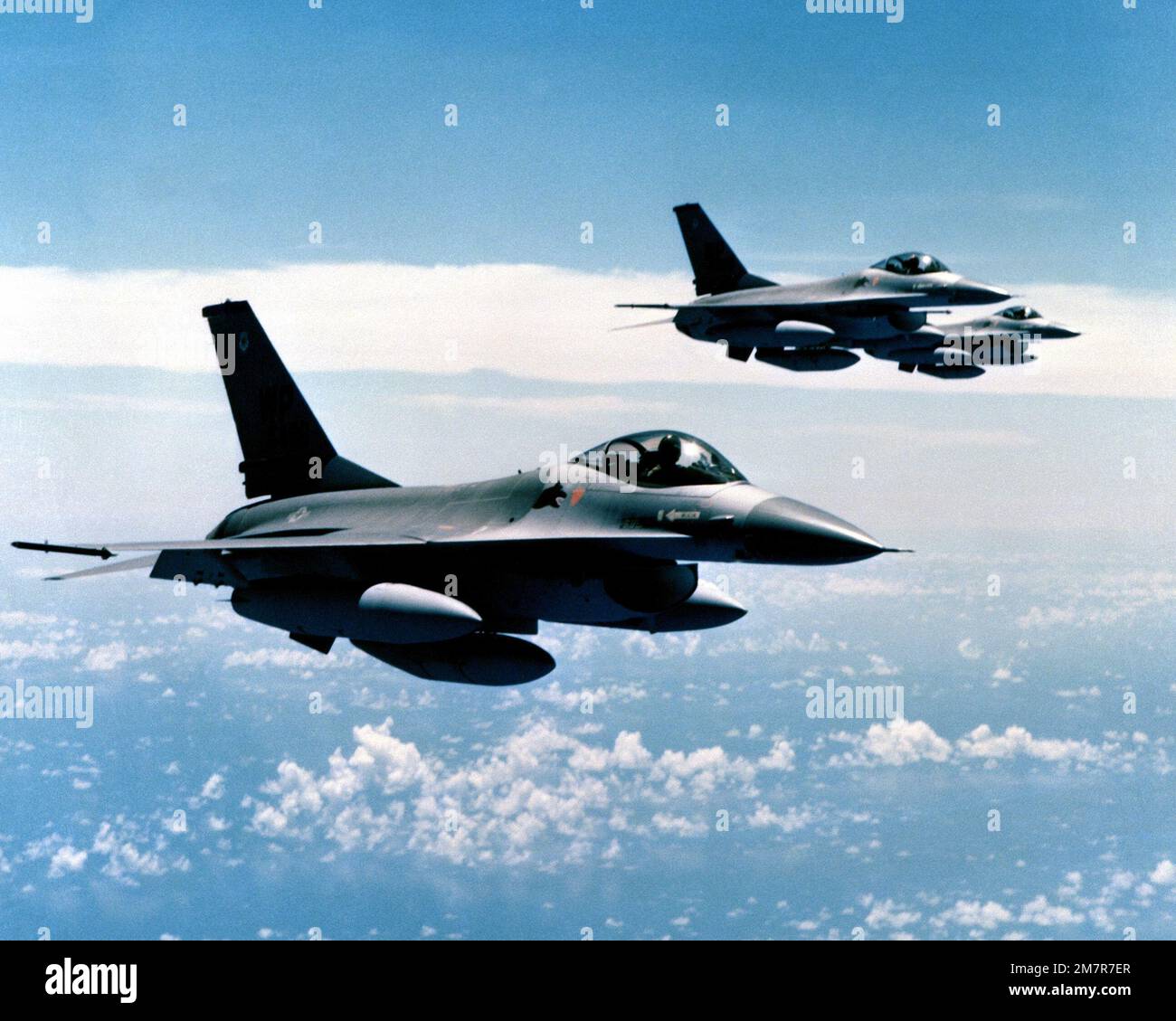 A right front view of three F-16A Fighting Falcon aircraft during ...