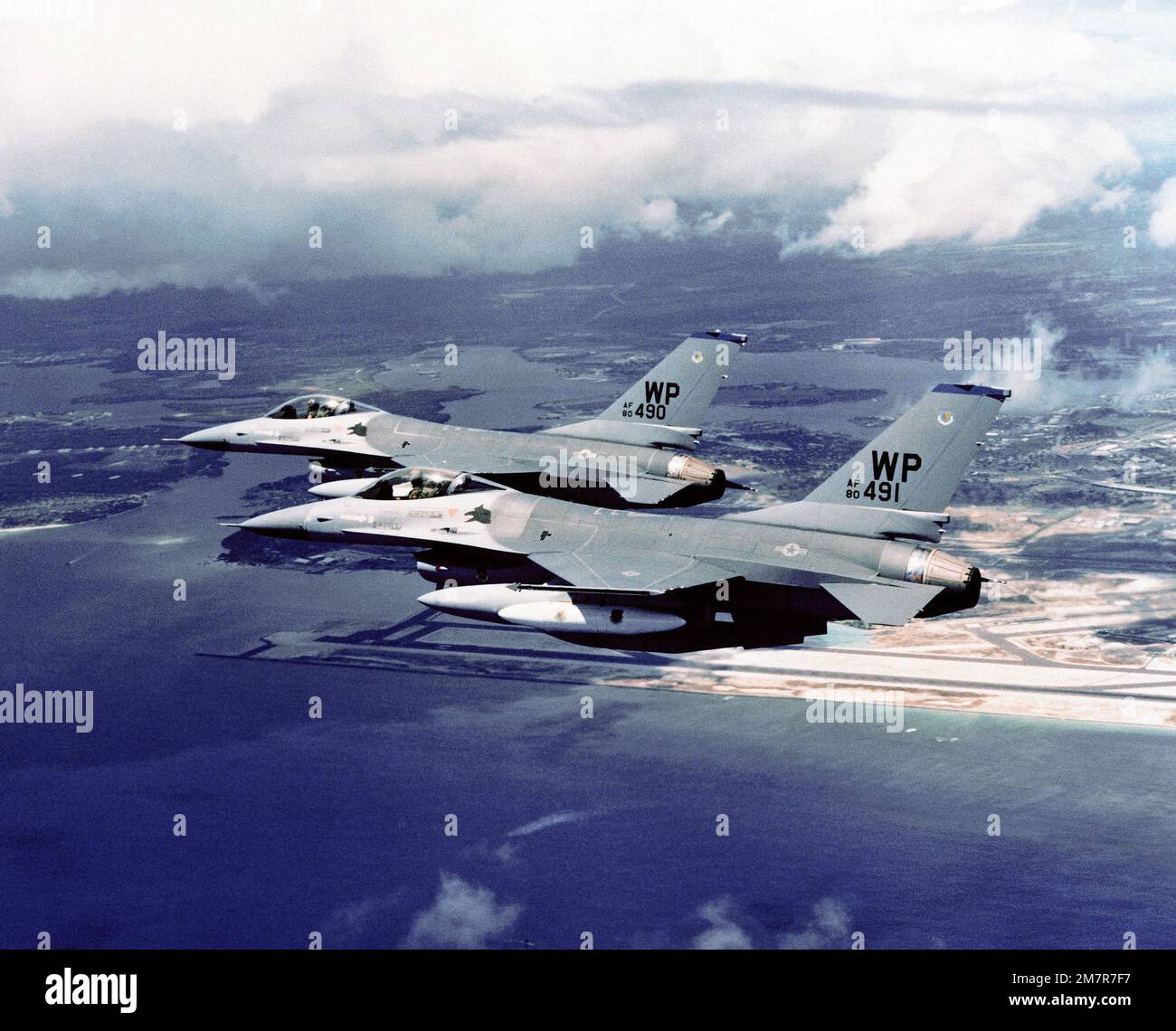 A left side view of two F-16A Fighting Falcon aircraft during ...