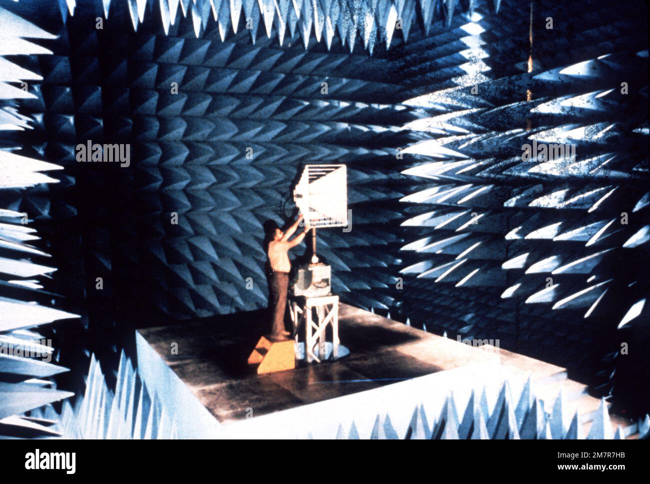 A technician adjusts the instrumentation of a laser-guided bomb for an ...