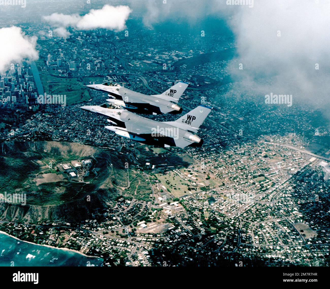 A left side view of two F-16A Fighting Falcon aircraft during ...