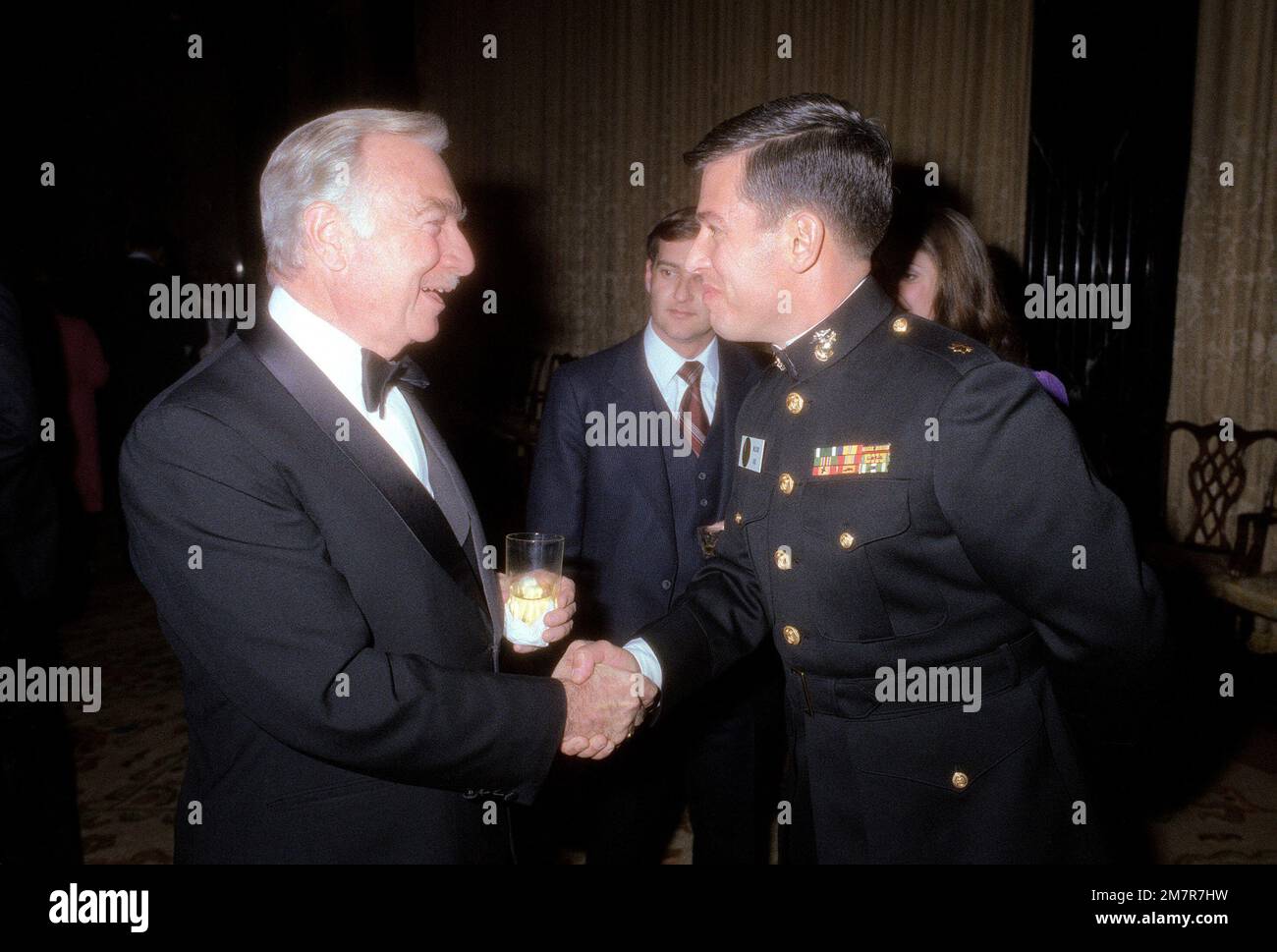 A Marine Corps major shakes hands with Walter Cronkite, the famous ...