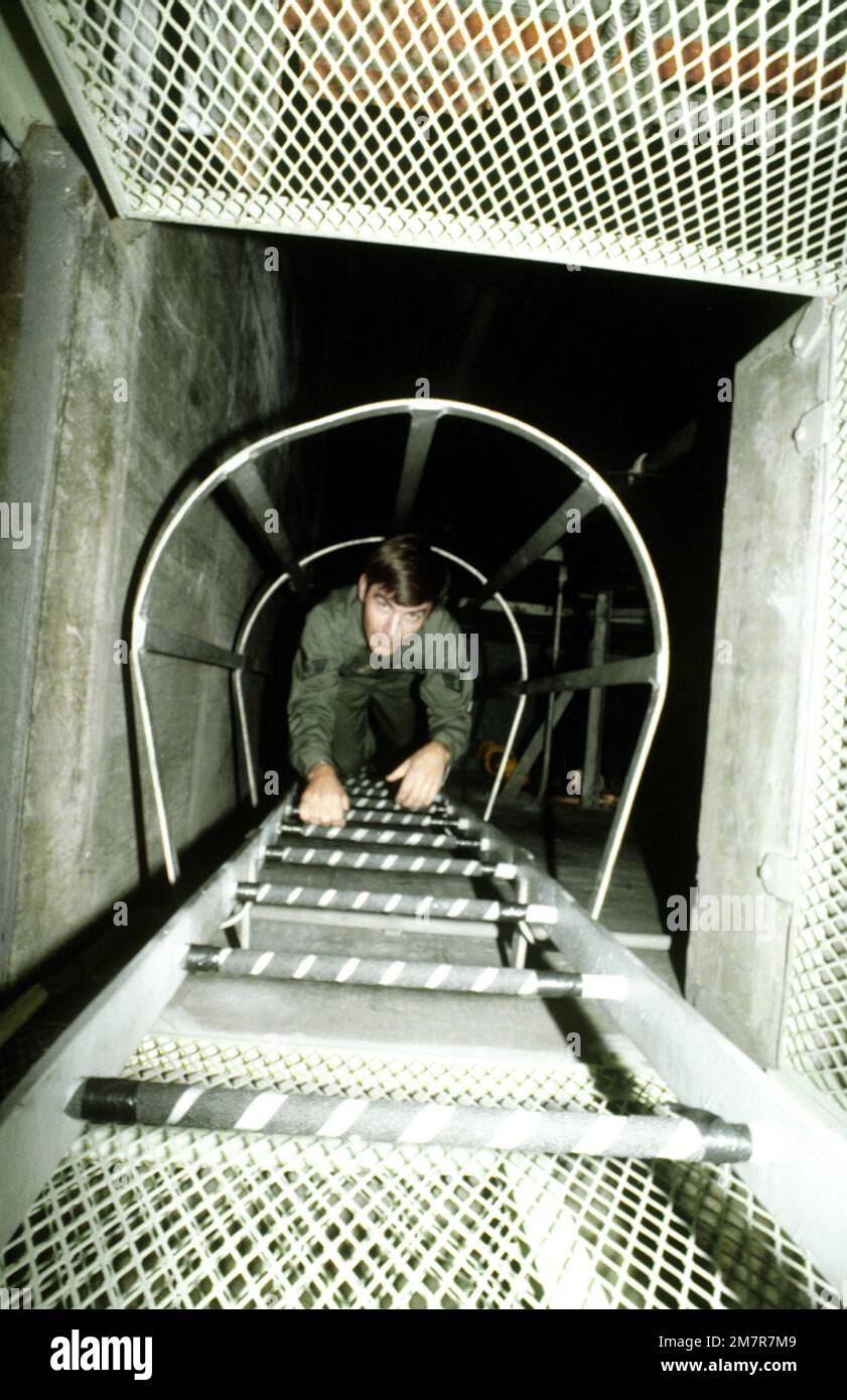 SSGT David Pierce crawls down the ladder to the combat crew capsule ...