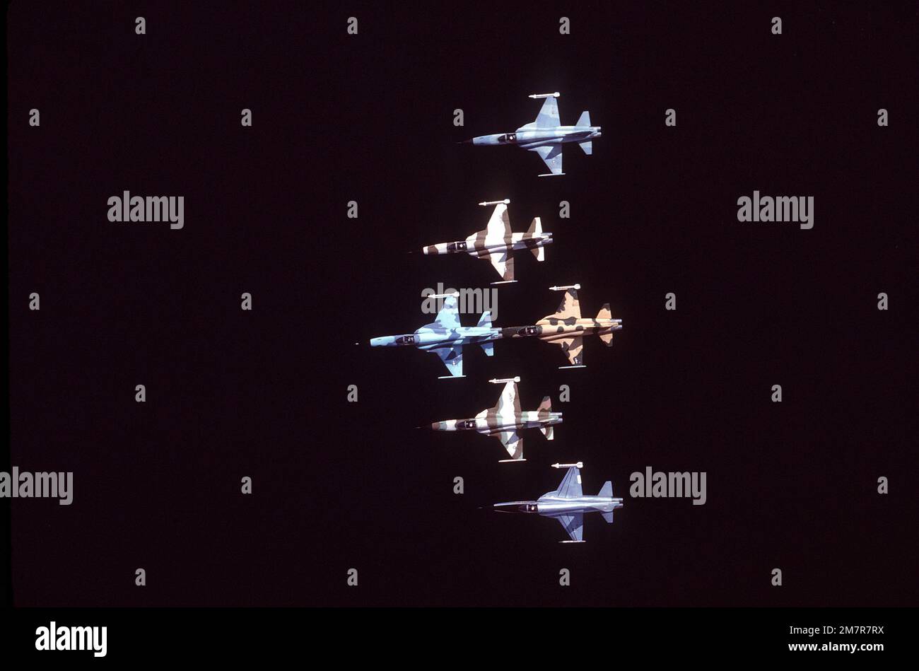 AN air-to-air overhead view of a six-ship delta formation of F-5E Tiger ...