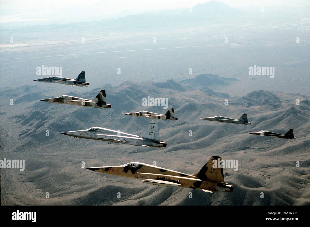 AN air-to-air left side view of a seven-ship wedge formation of F-5E ...
