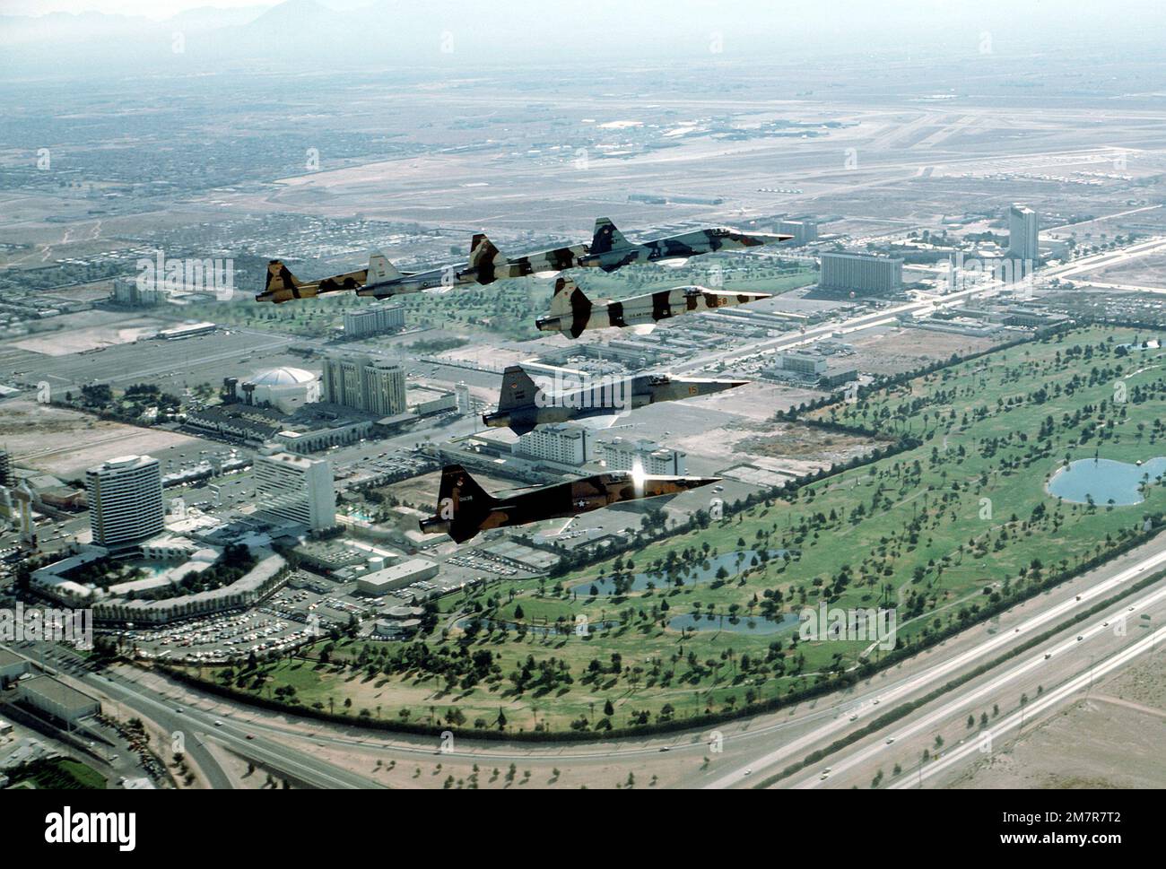 AN air-to-air right side view of a seven-ship wedge formation of F-5E ...