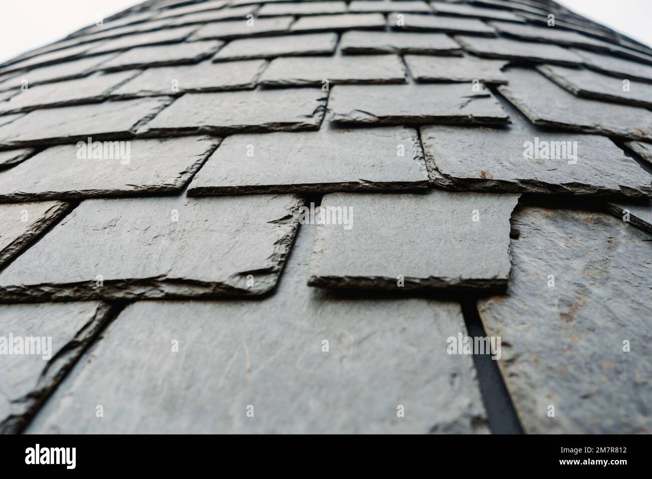 Detail of slate tiles on a medieval roof, a traditional way of ...