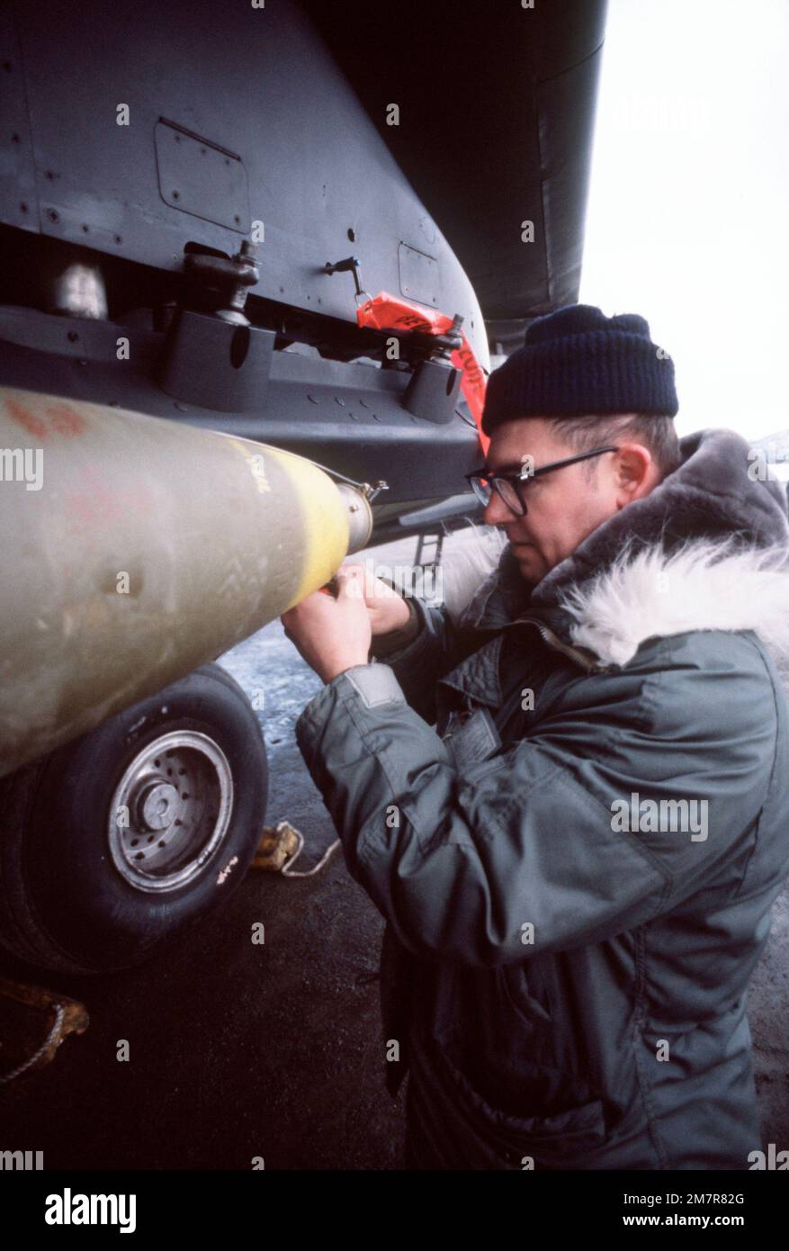 MSGT George Haresky removes safety devices from the M-904 nose fuse of ...