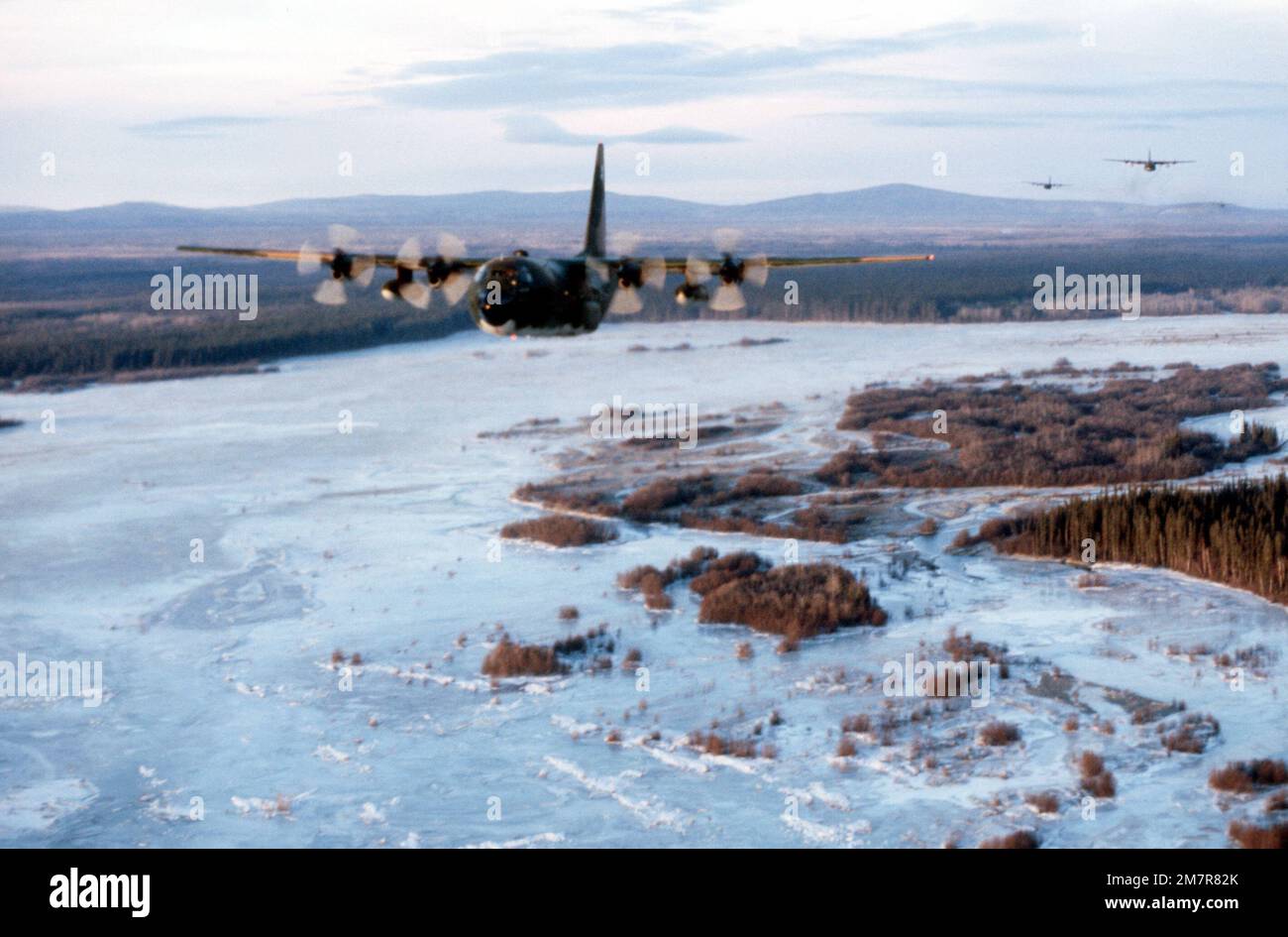 A left front view of an AC-130A Hercules gunship, followed by the other ...