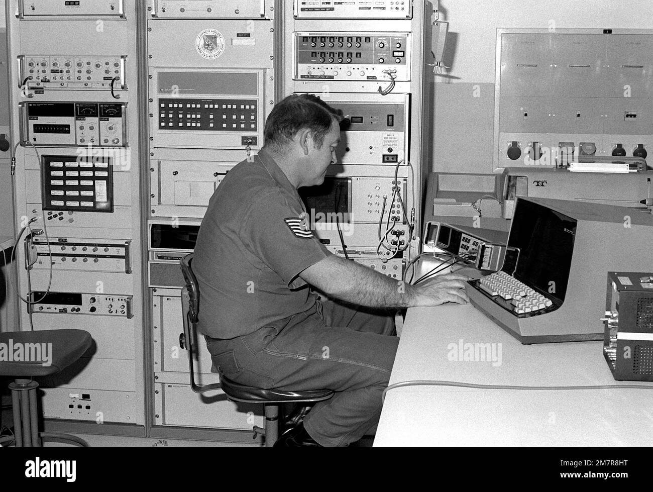 A technical sergeant uses a computer to calibrate a voltmeter. Base ...