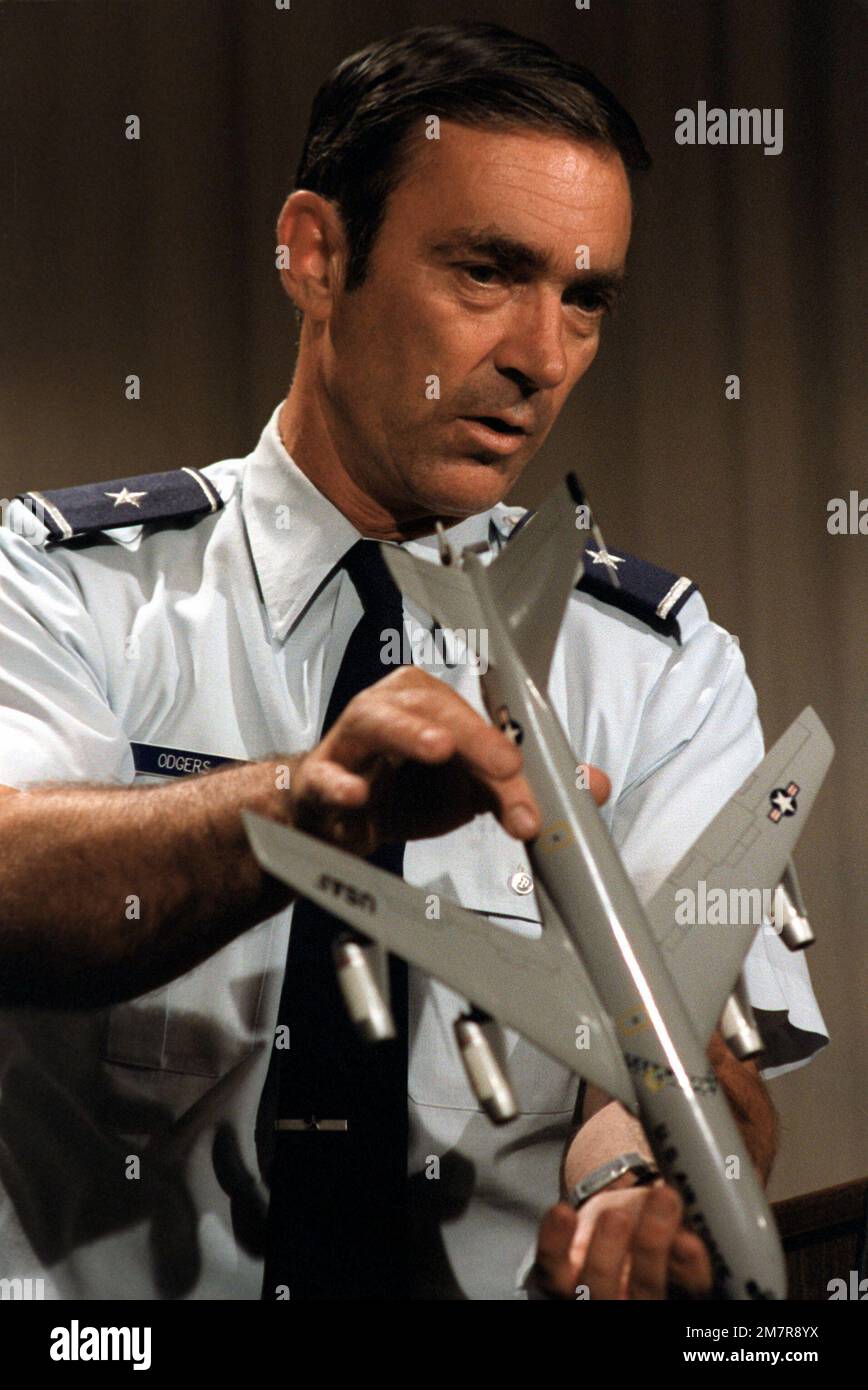 BGEN Peter W. Odgers prepares himself for a press conference on his panel's findings on the ...