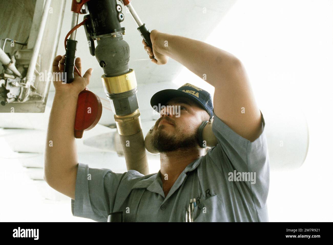 Navy personnel refuel a C-5 Galaxy aircraft during Airlift Operations ...