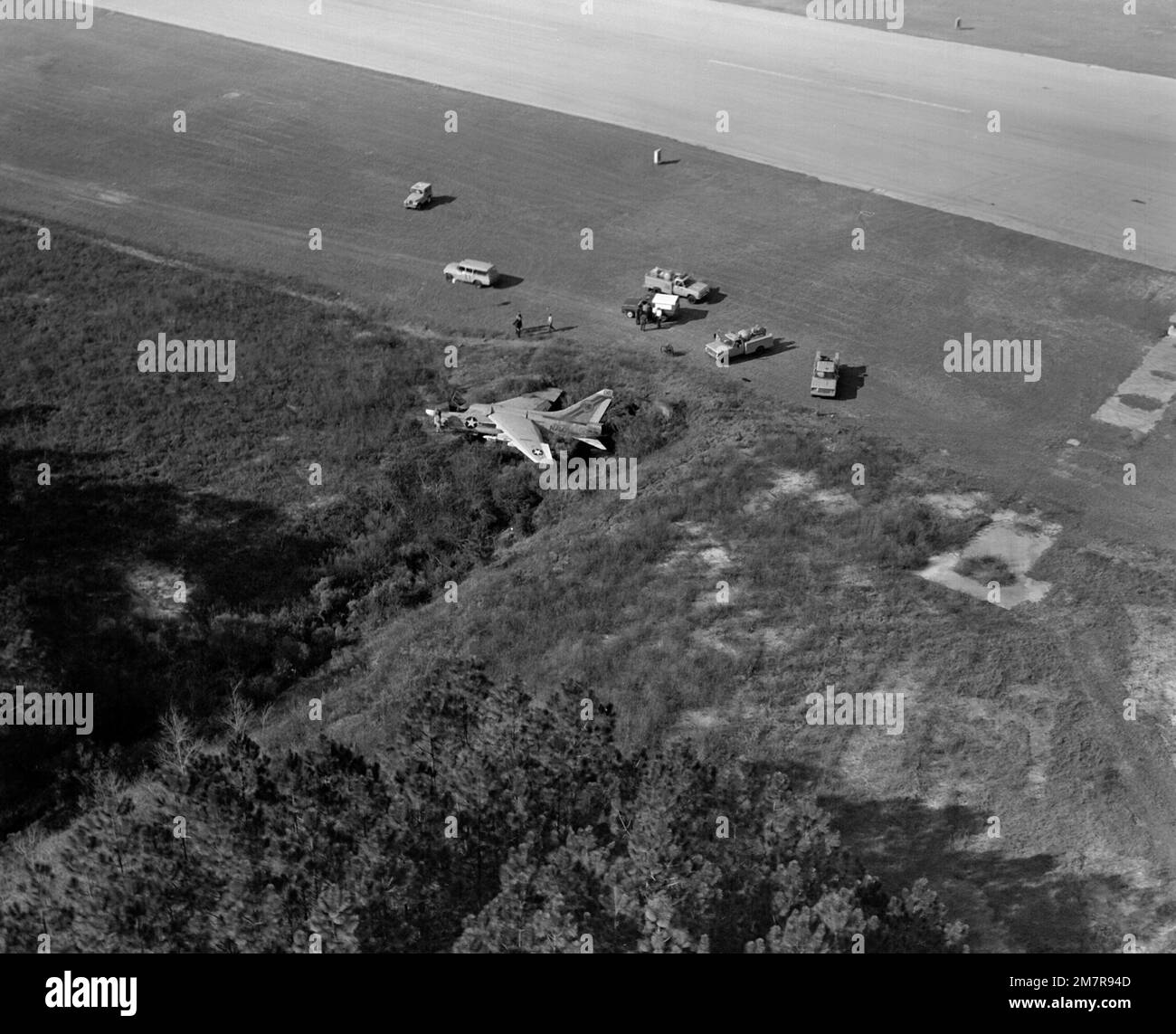 An Attack Squadron 66 (VA-66) A-7E Corsair II rests in the field where ...