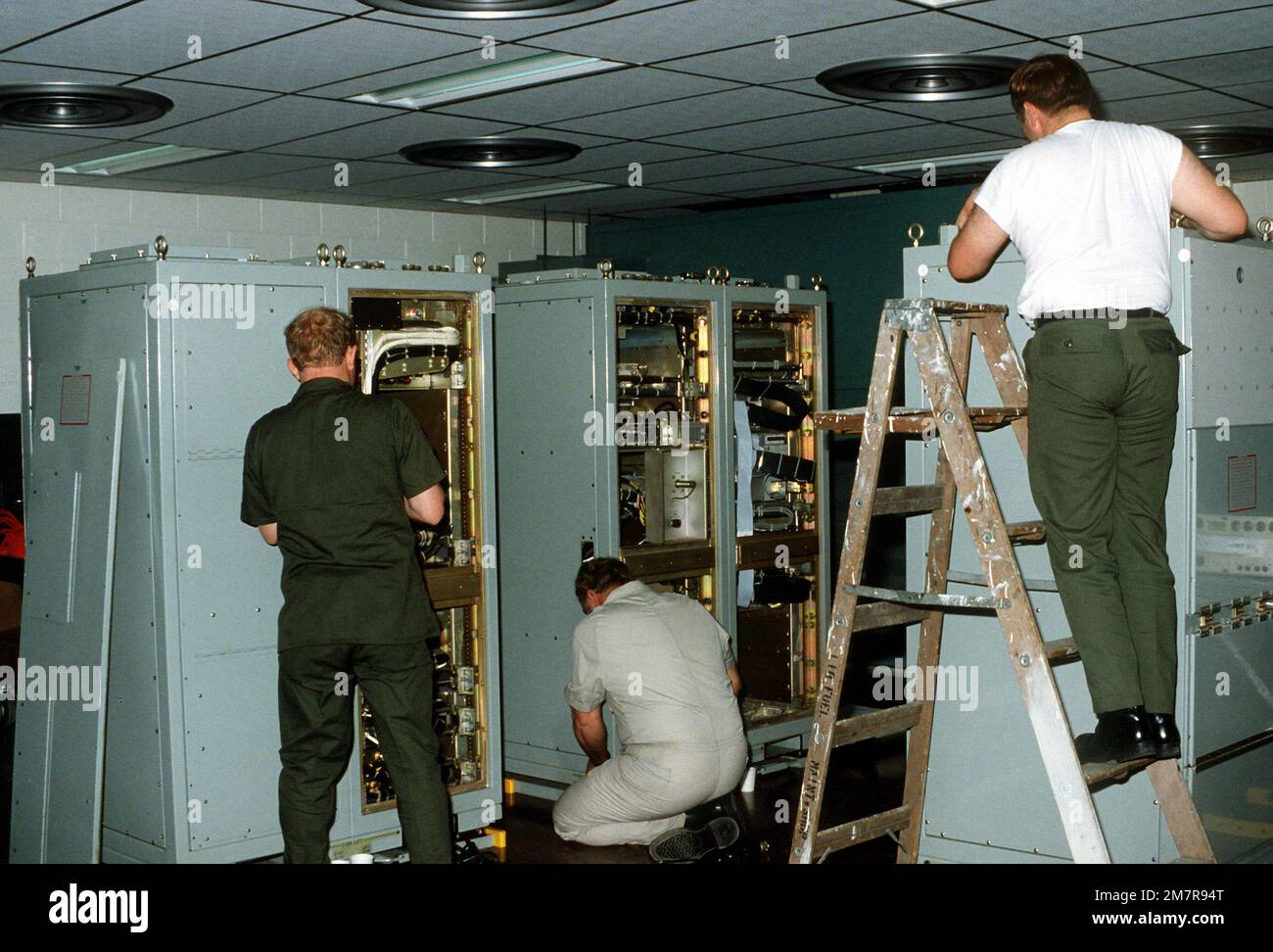Technicians install the equipment used for the testing of the F-16 ...