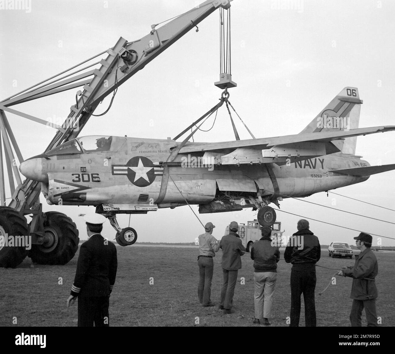 An aircraft crane is used to hoist an Attack Squadron 66 (VA-66 ...