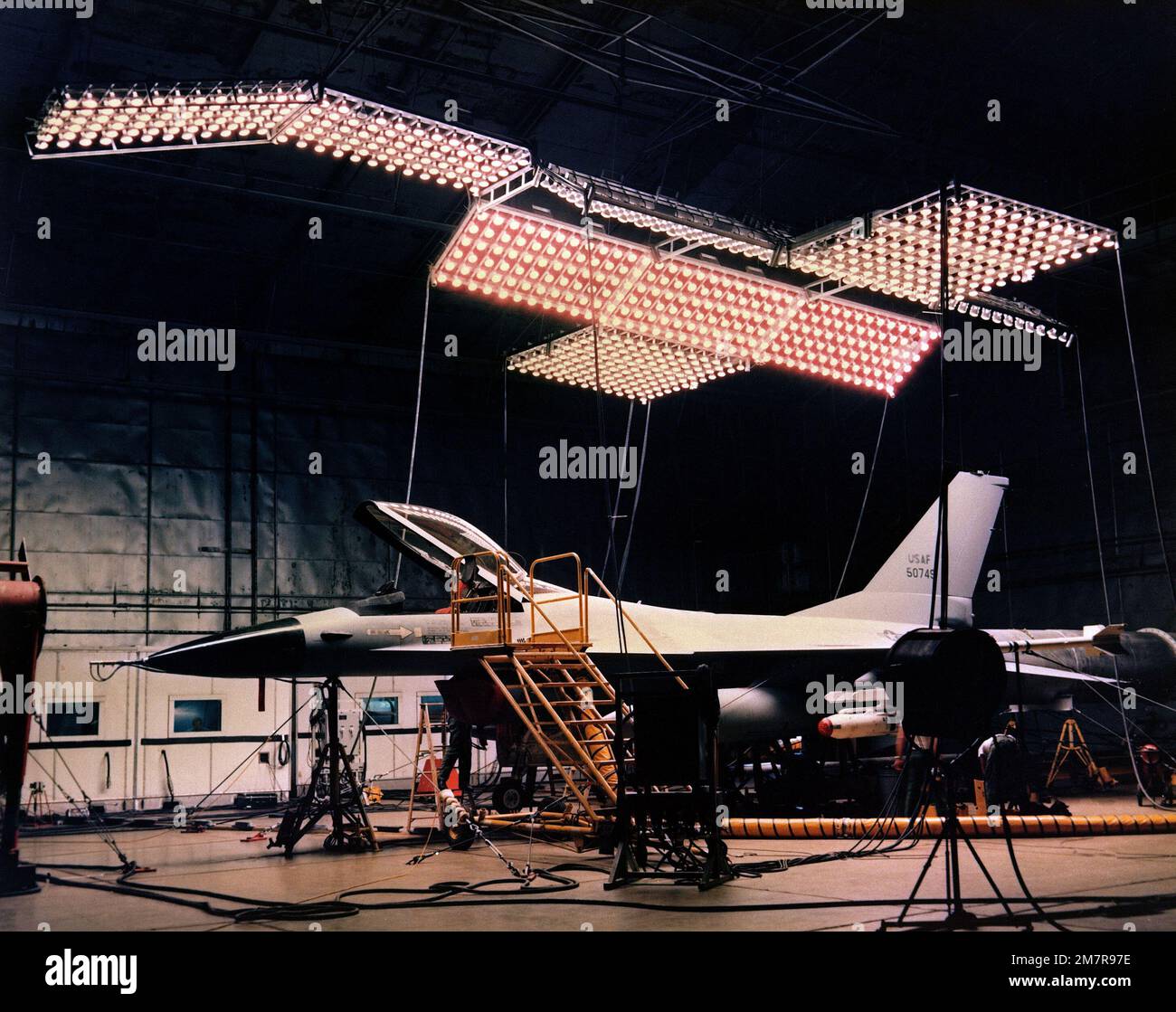 Left side view of an F-16 Fighting Falcon aircraft undergoing climatic ...