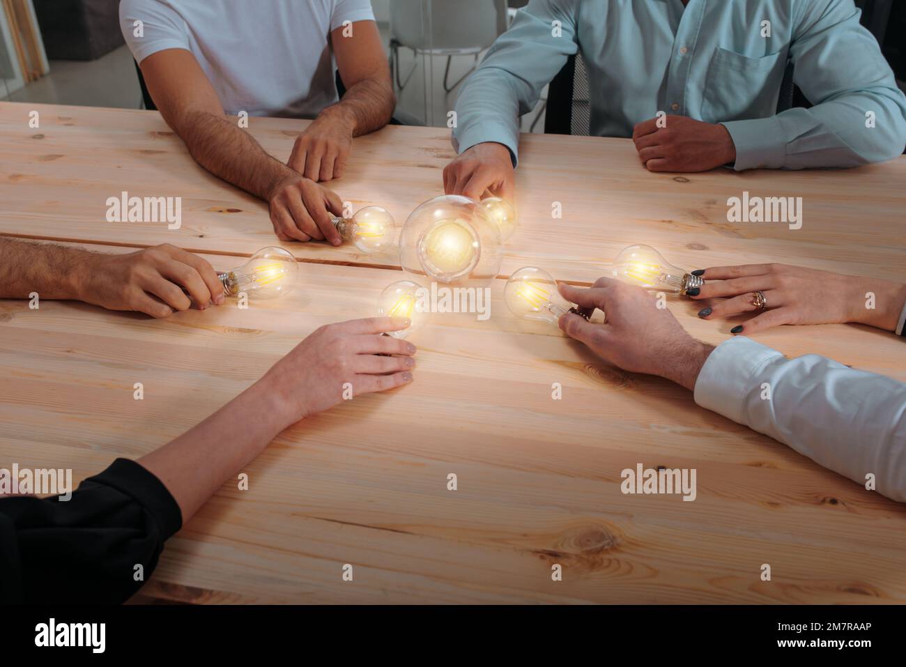 Teamwork of partners connect lightbulbs as invention a new idea Stock ...