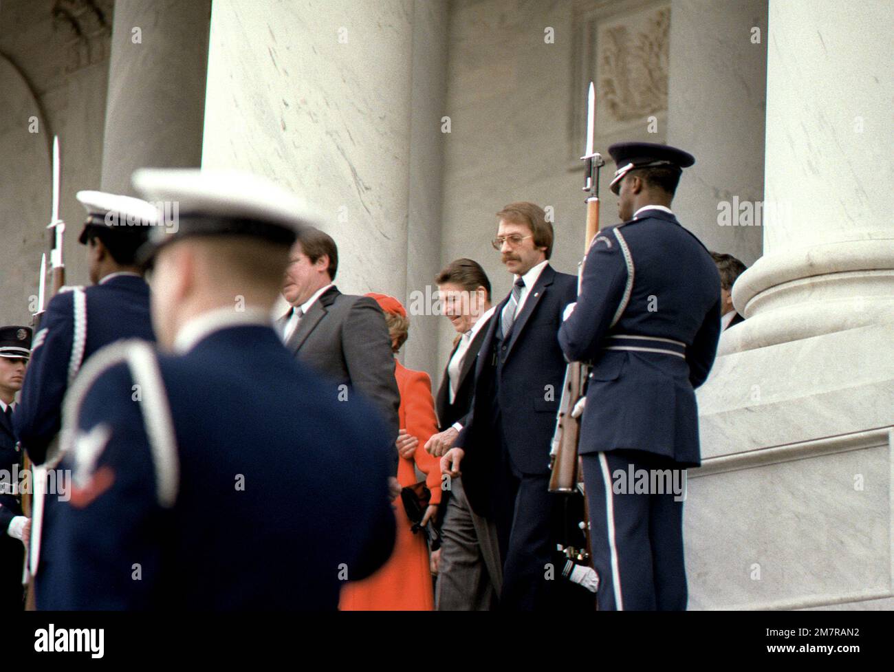 An Air Force member of the All-Service Honor Guard stands with his ...