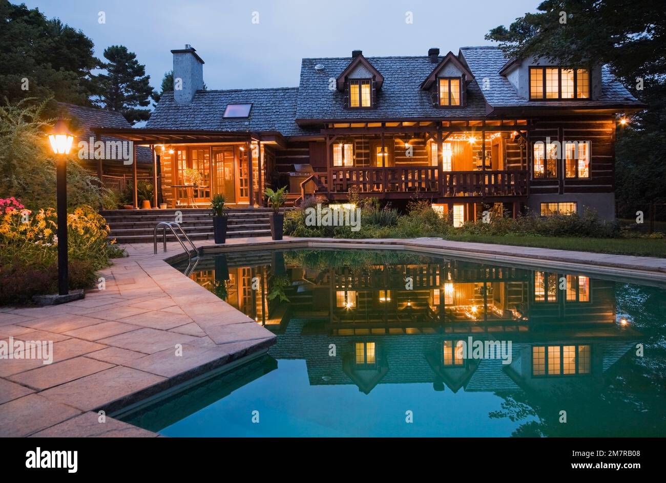 In-ground swimming pool and back of 1976 reconstructed cottage style ...