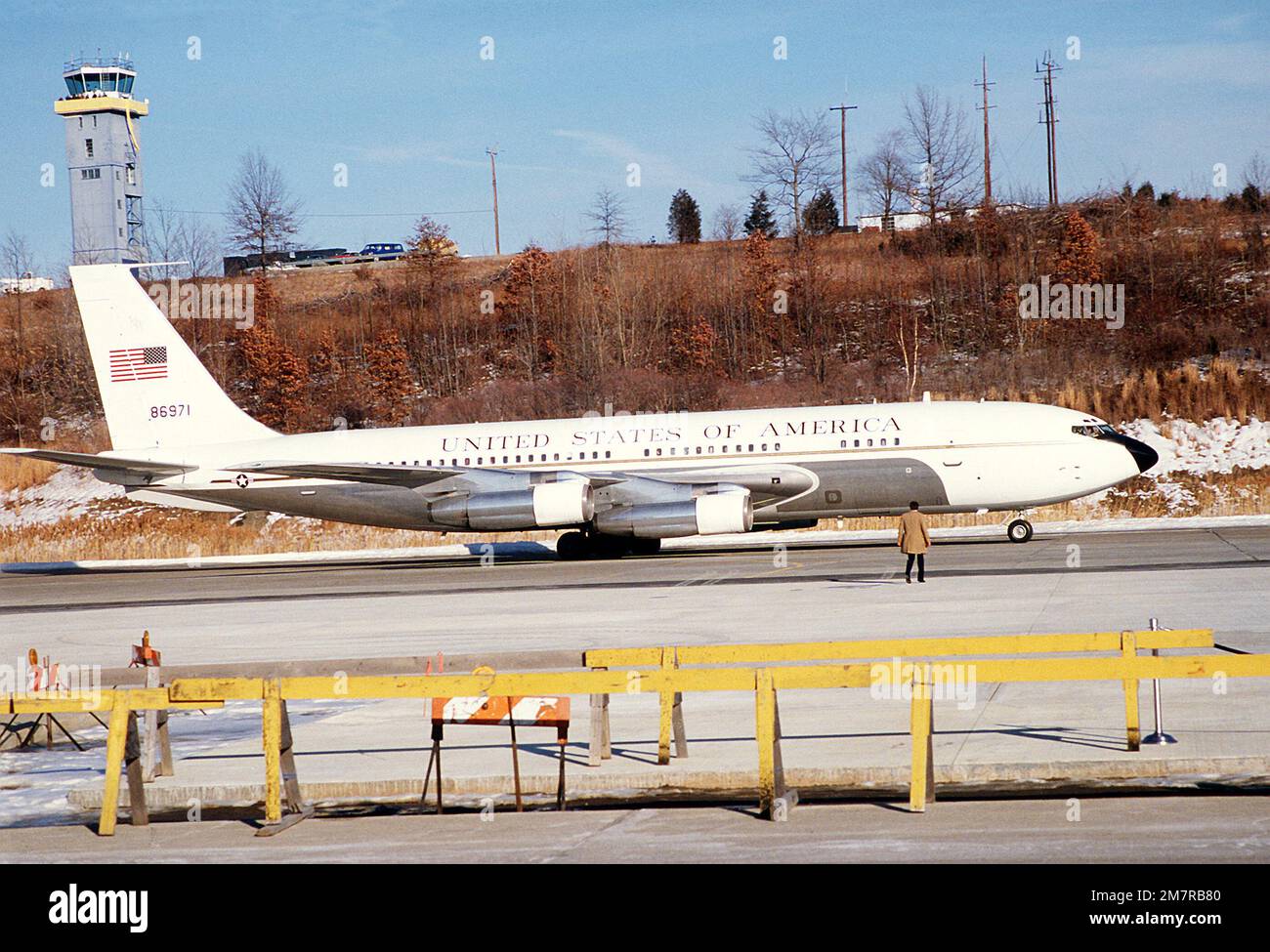 Right side view of the VC-137 aircraft (parked) with former hostages ...