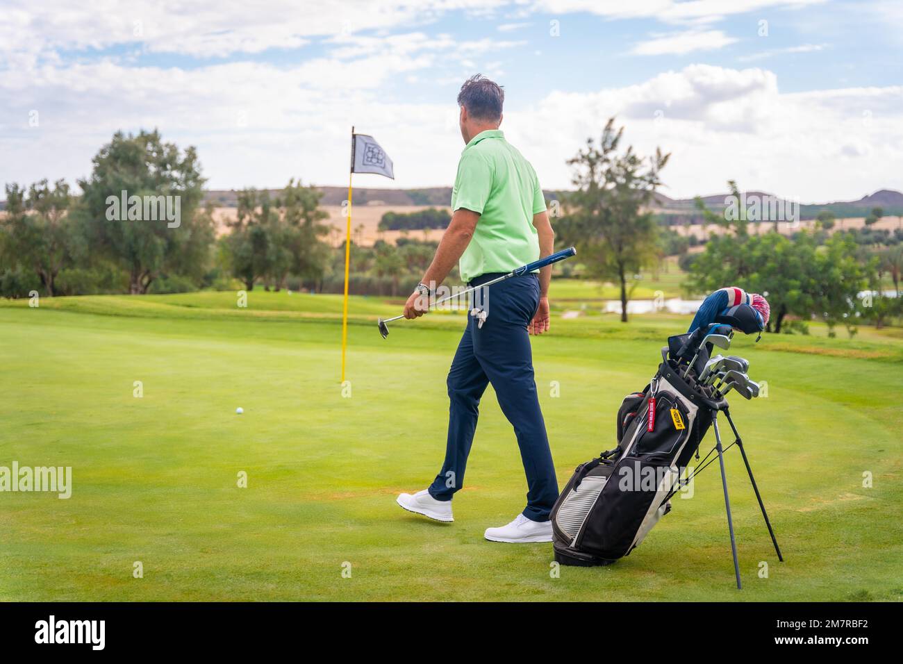 Golf player preparing shot hi-res stock photography and images - Alamy