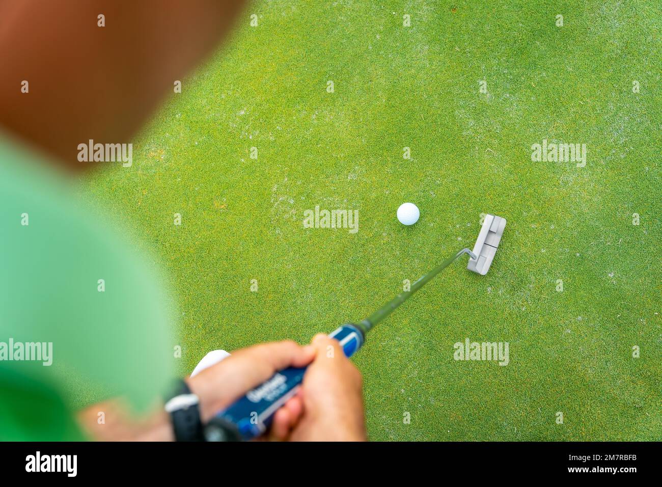 Man playing golf, detail of a shot with the putter on the green Stock ...