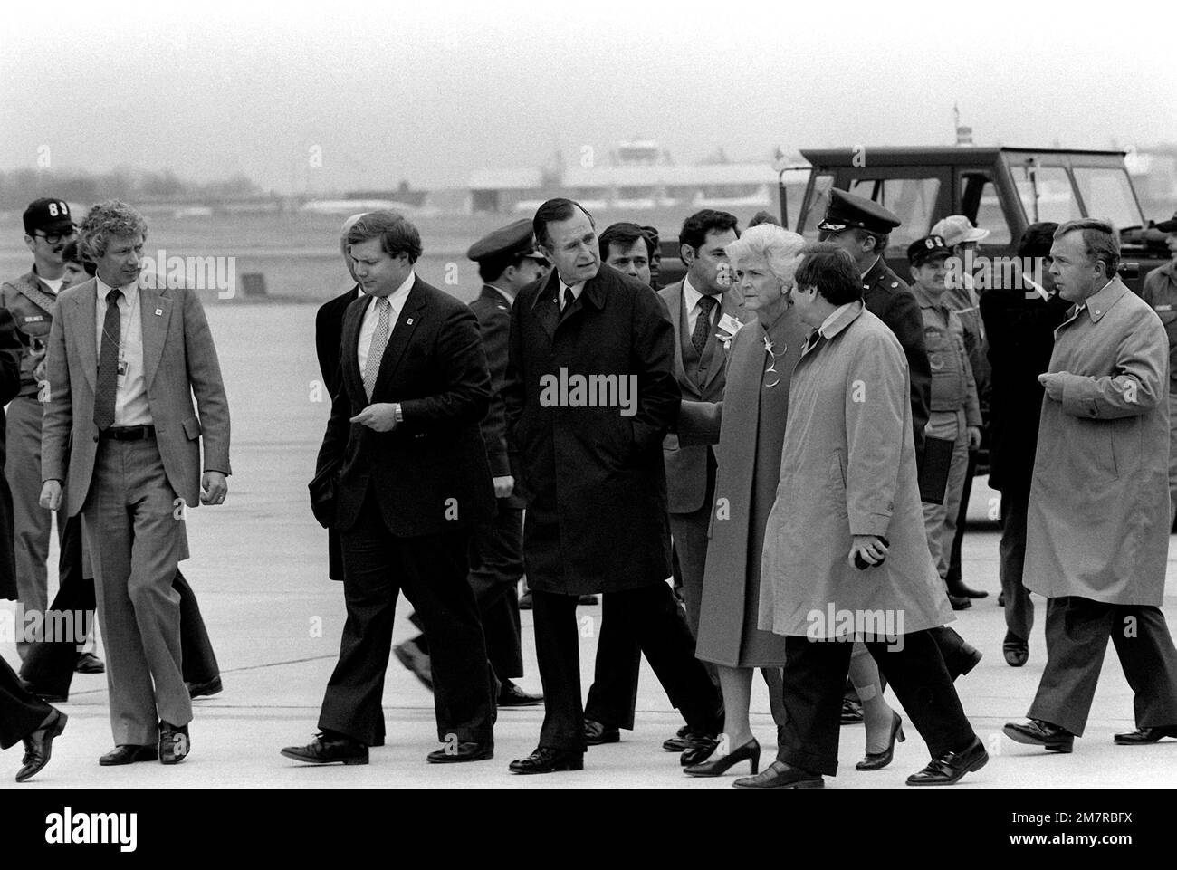 Vice President George Bush, left, and Mrs. Bush walk toward Freedom One ...