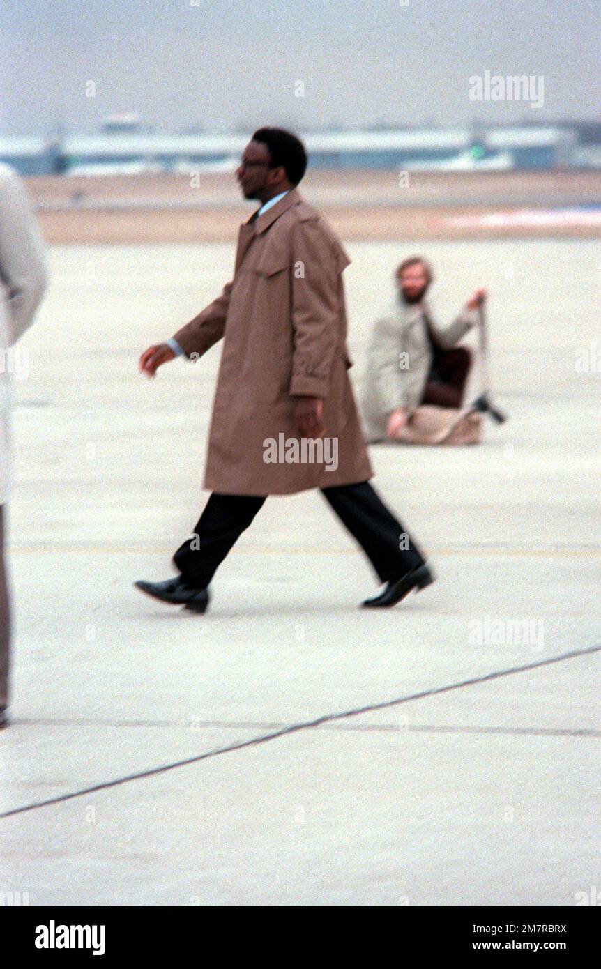 Former Iranian hostage Charles Jones walks across the runway upon his ...