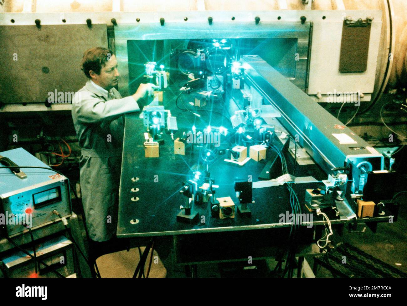 A technician at the Arnold Engineering Development Center adjusts the ...