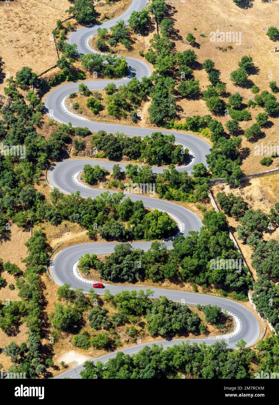 Aerial view of a curved road, car, red Stock Photo - Alamy