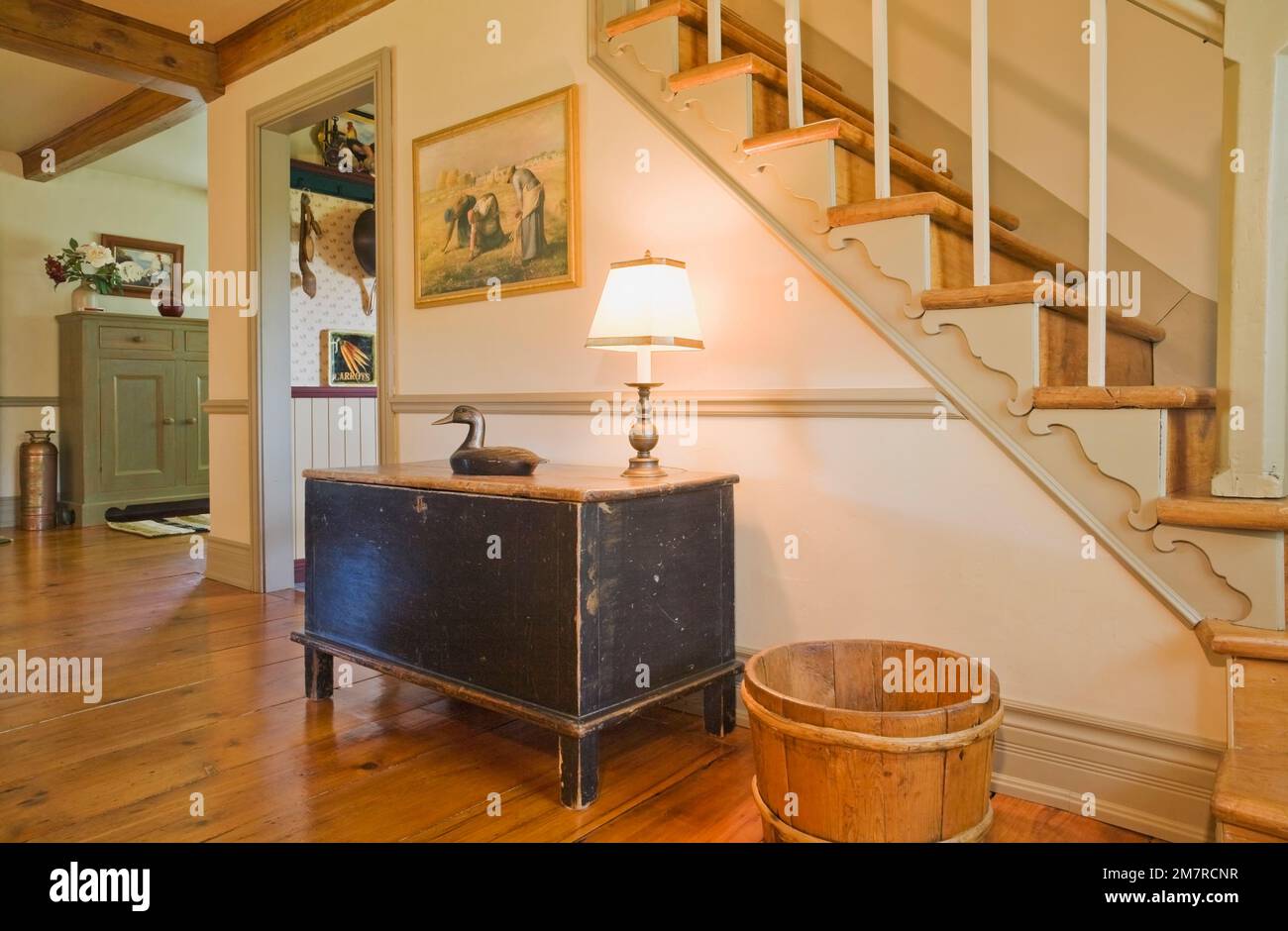 Old wooden blue painted chest table and staircase in living room inside ...