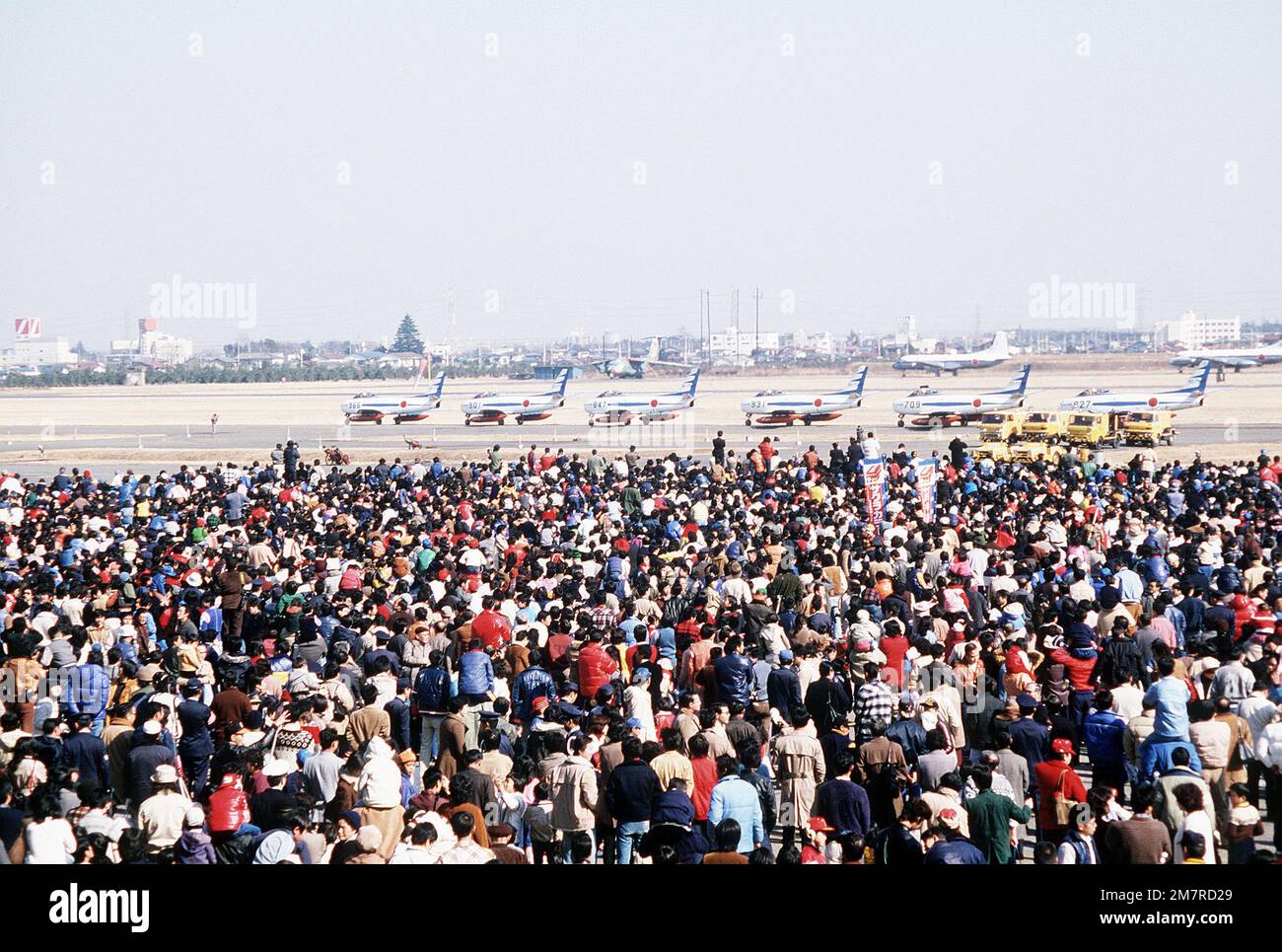 A large crowd watches as five F-86F aircraft from the Japanese Blue ...