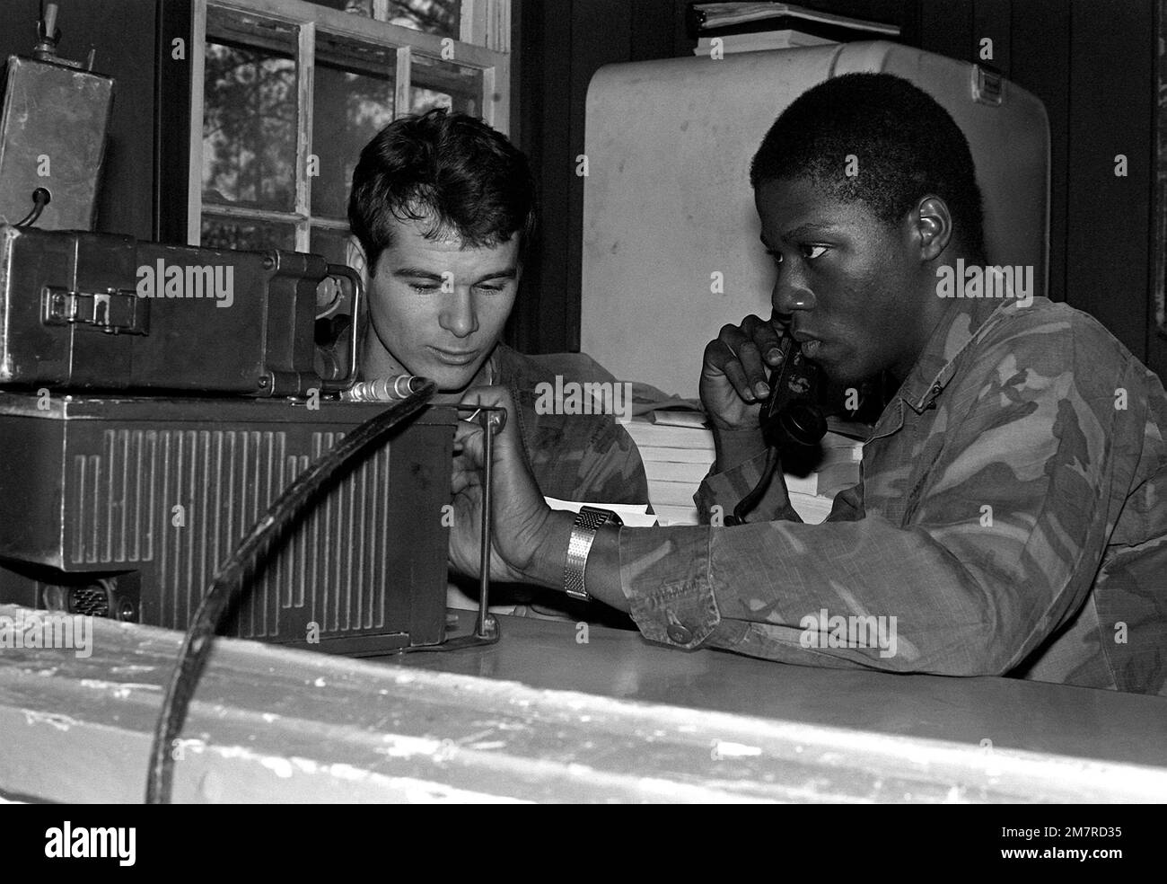 Two field radio operators send and receive messages for Company D, 8th ...