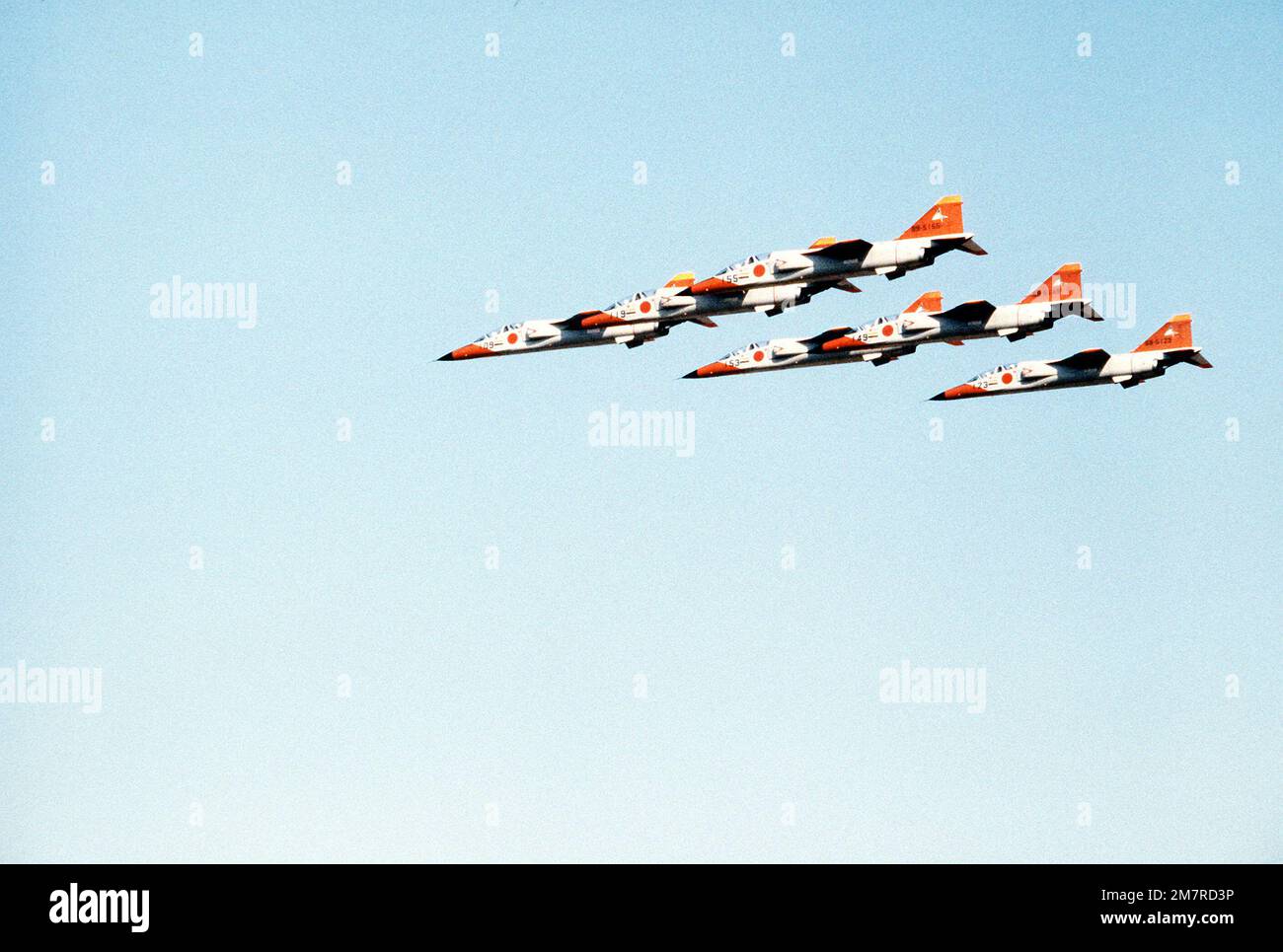 A left side view of six T-2 Mitsubishi jet trainer aircraft flying in ...