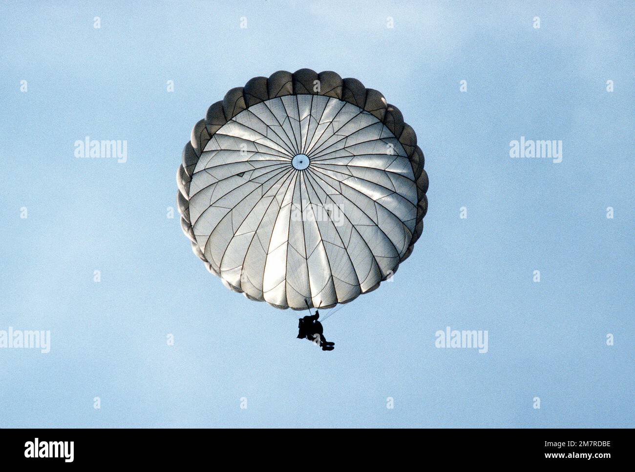 An Air Force Reserve flight surgeon descends after jumping from a C-141 ...