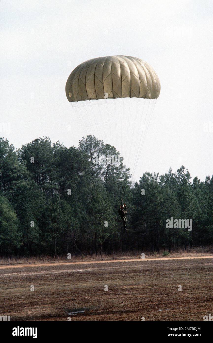 An Air Force Reserve flight surgeon descends after jumping from a C-141 ...