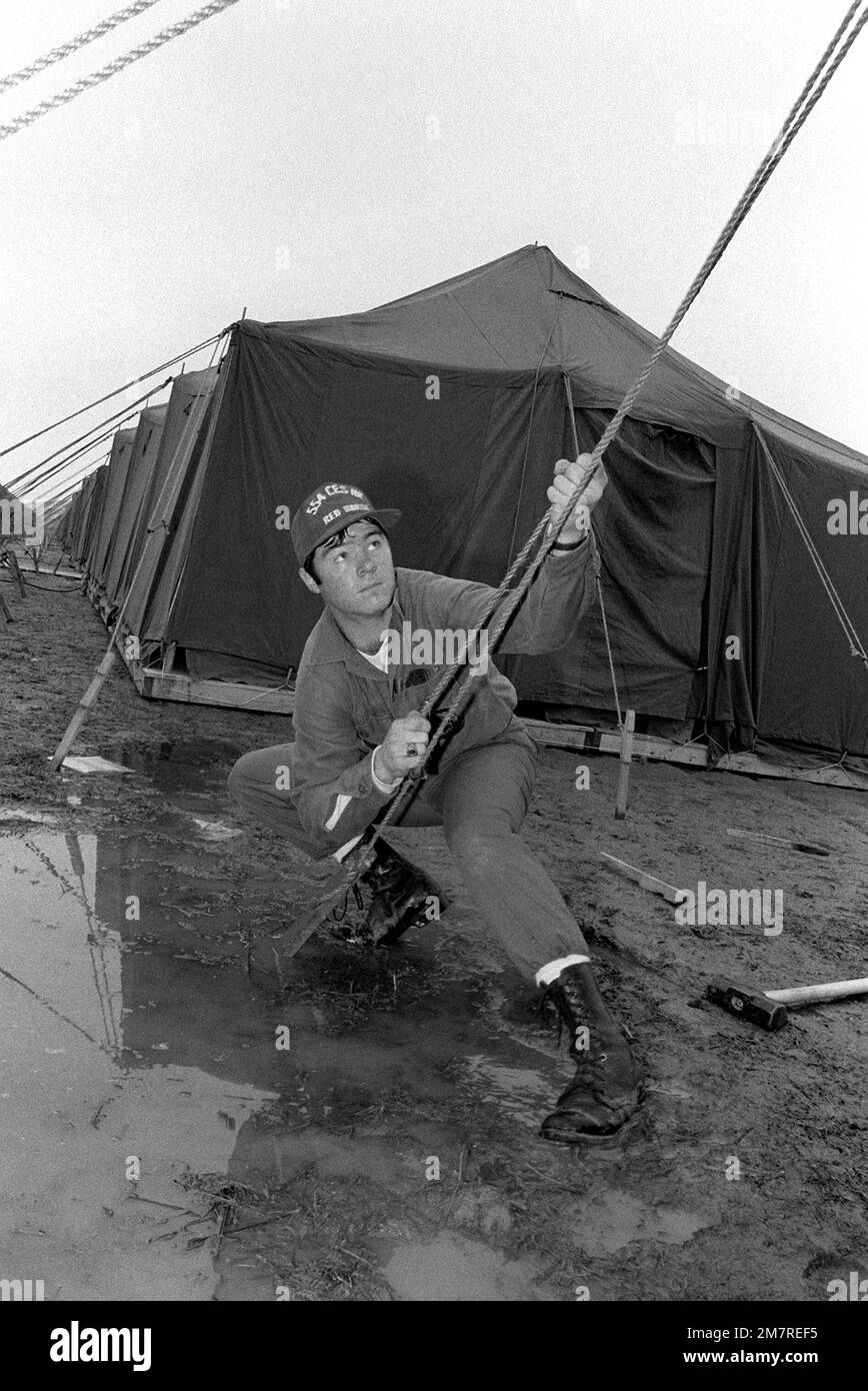 AMN Mike Dempsey, Red Horse Team, 554th Civil Engineer Squadron, helps ...