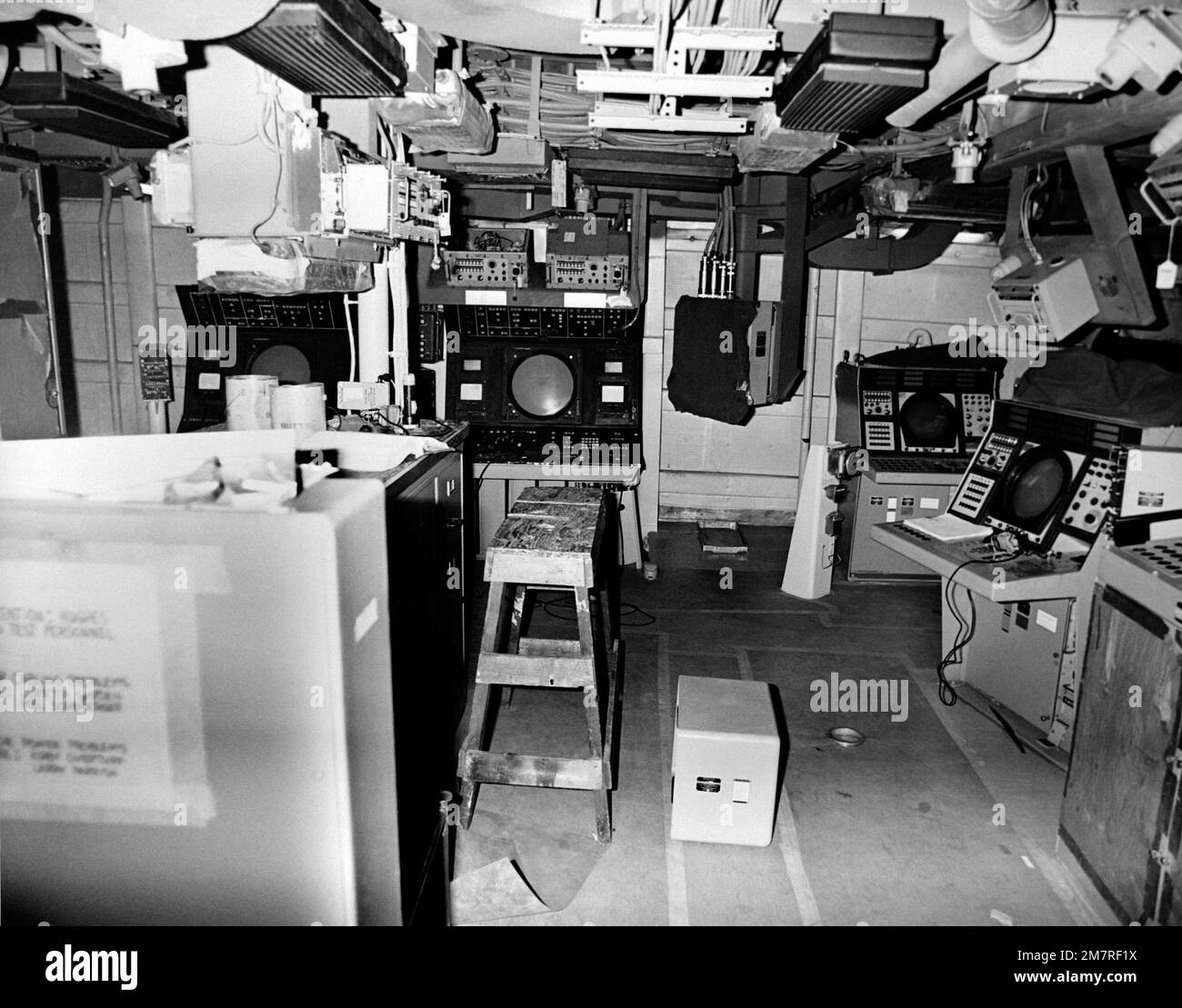 An interior view of the combat information center on the guided missile ...