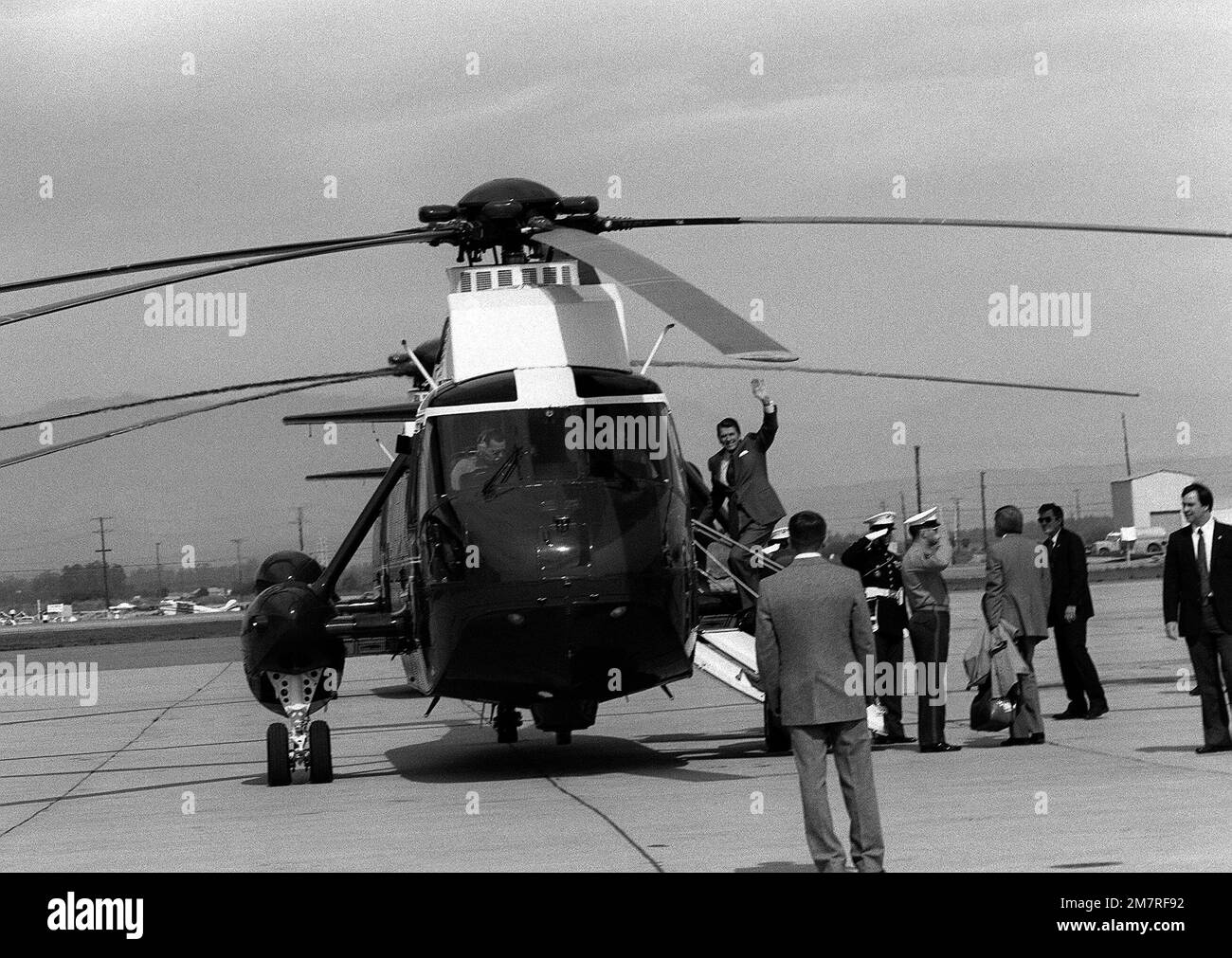 President Ronald Reagan waves as he boards a Marine VH-3A Sea King ...